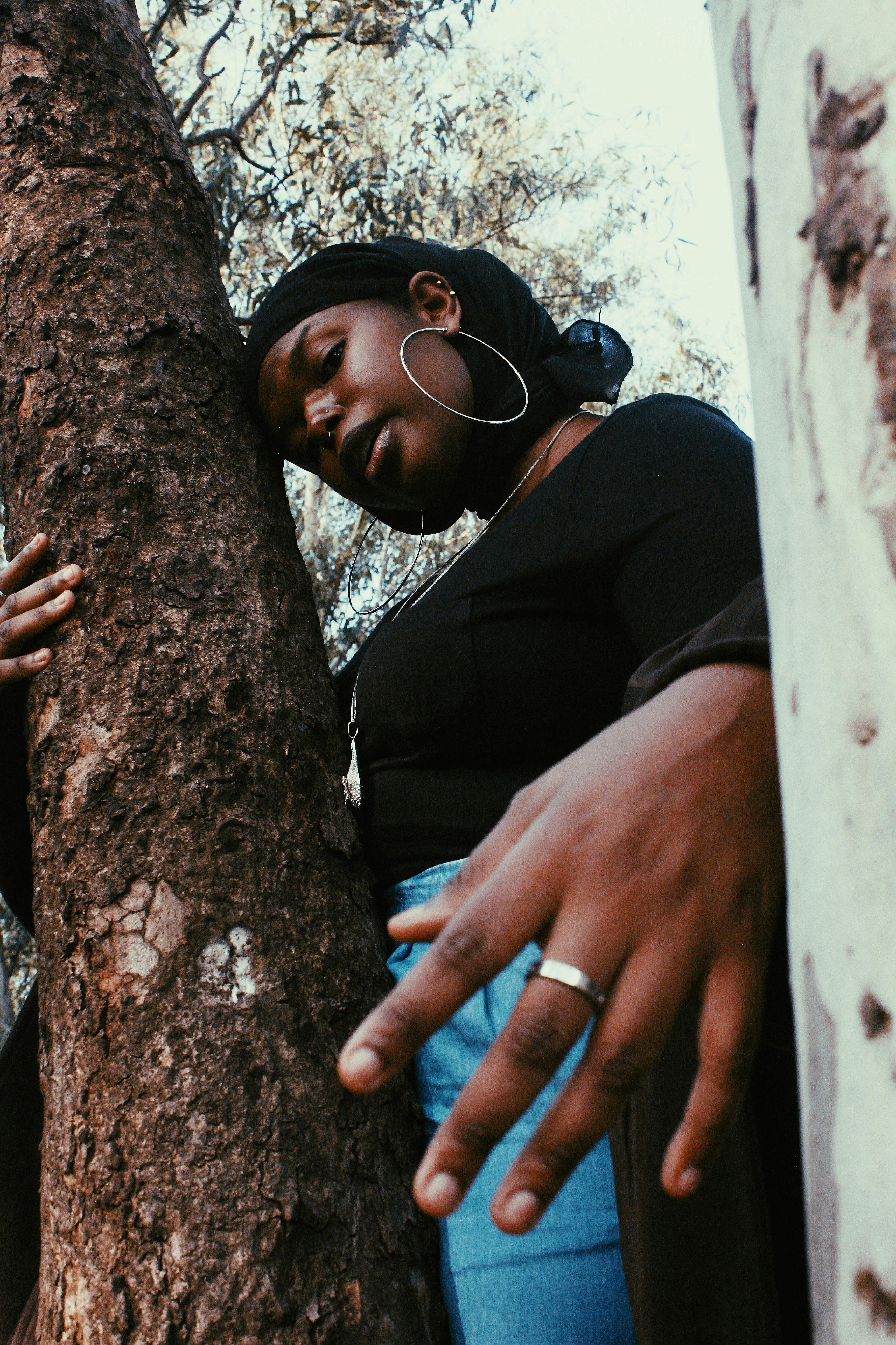African Woman Posing Among Trees · Free Stock Photo