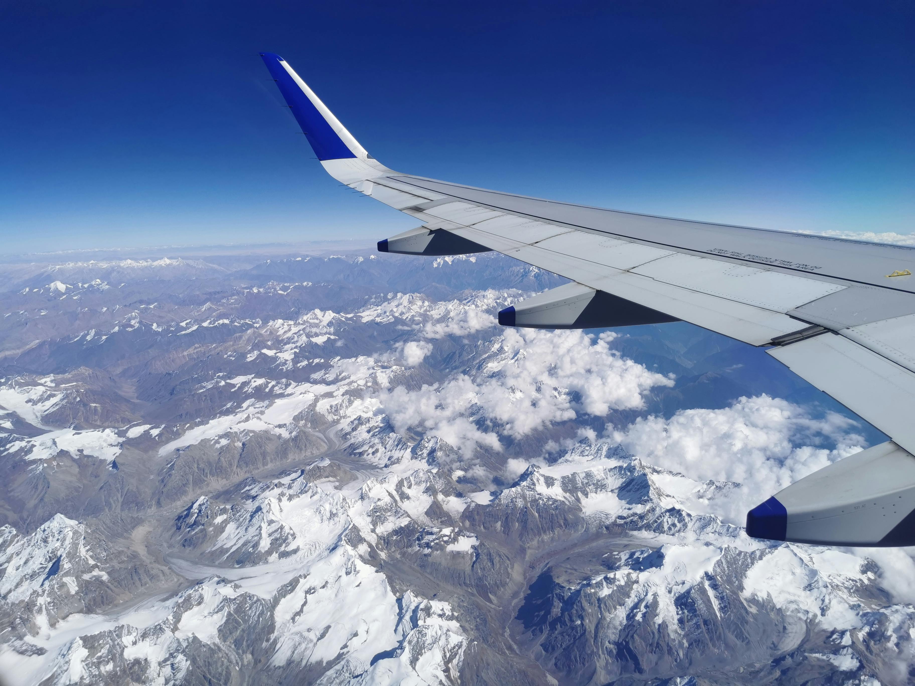 Airplane Wing behind Window · Free Stock Photo