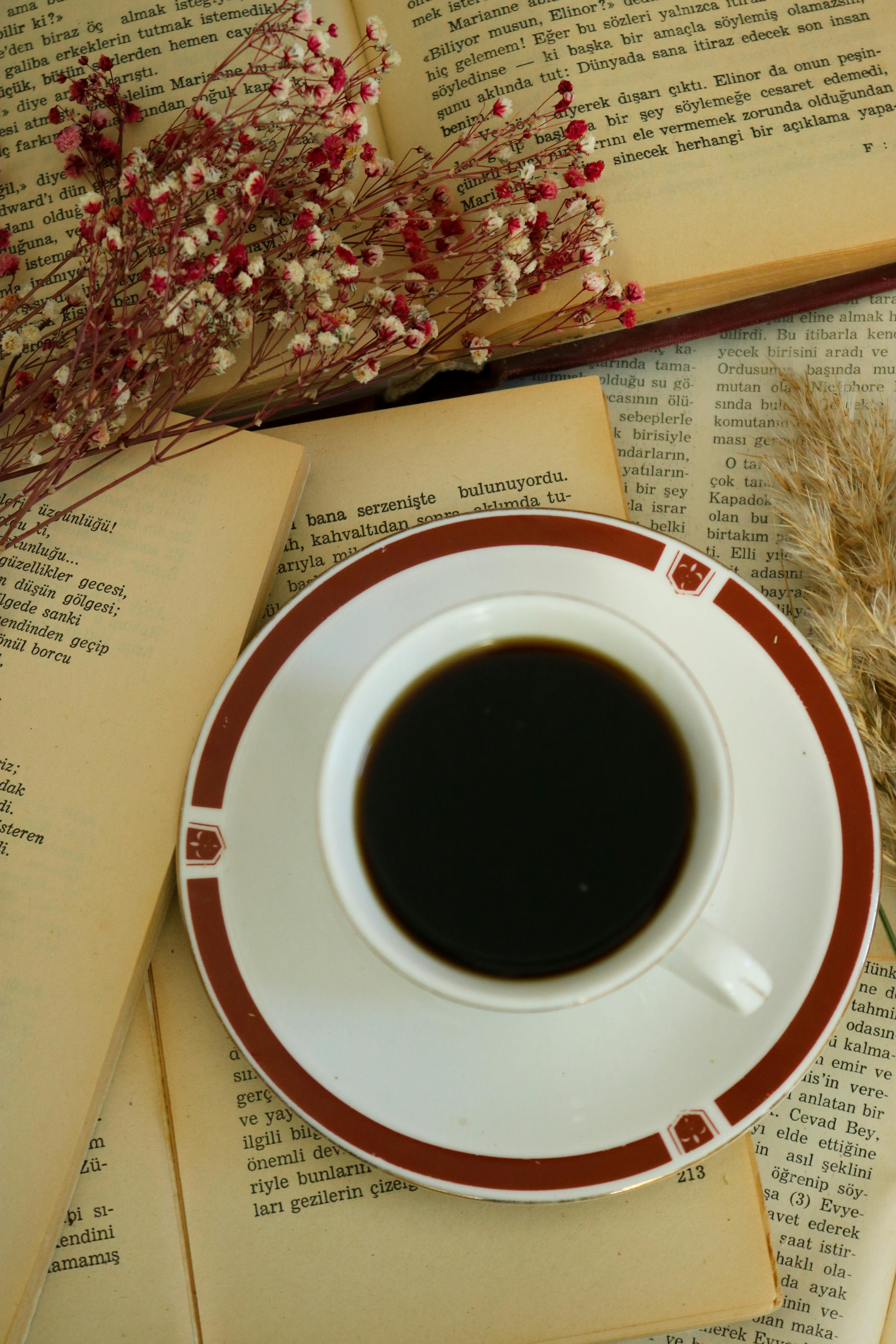 Cup of Coffee Near a Book · Free Stock Photo