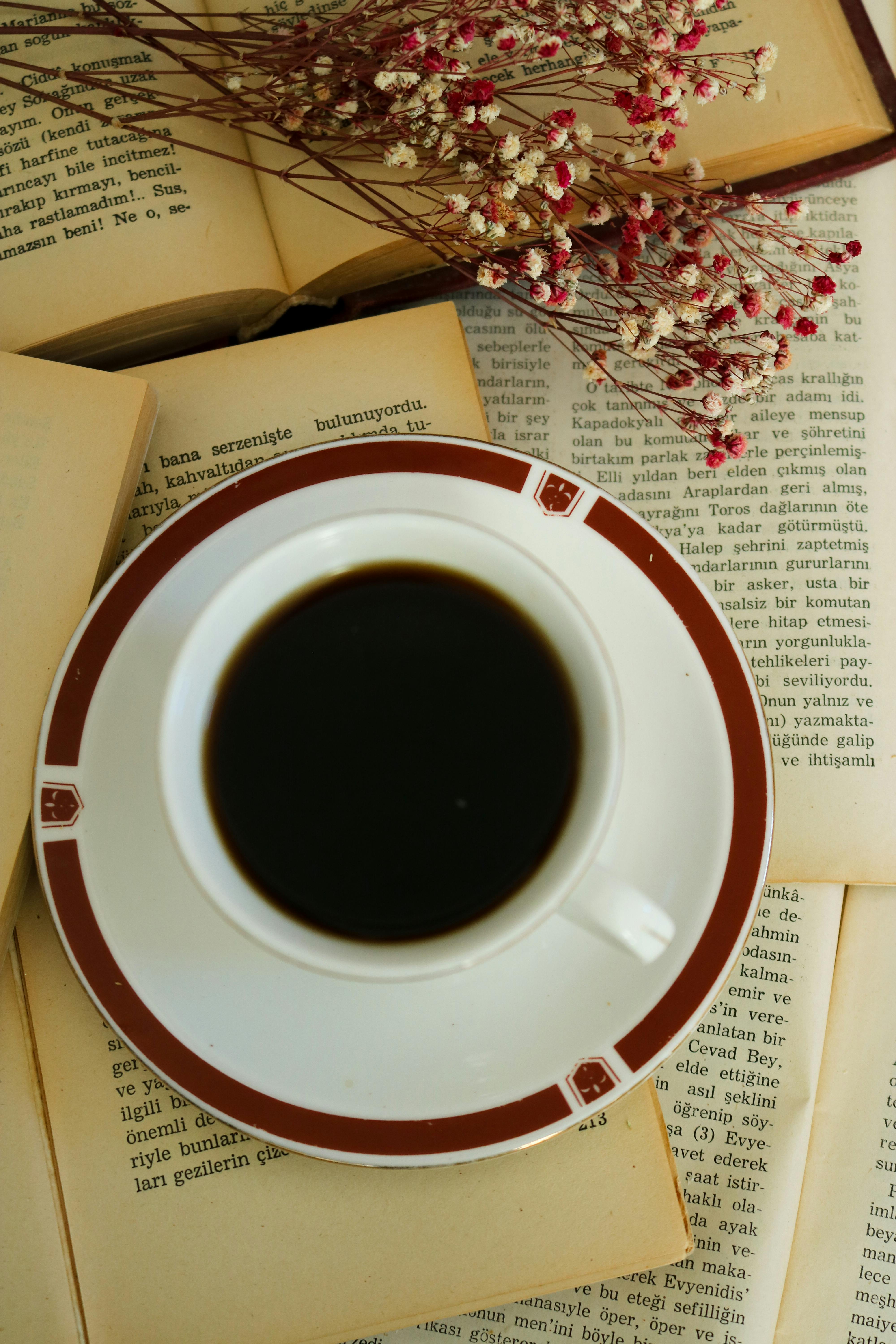 Cup of Coffee Near a Book · Free Stock Photo