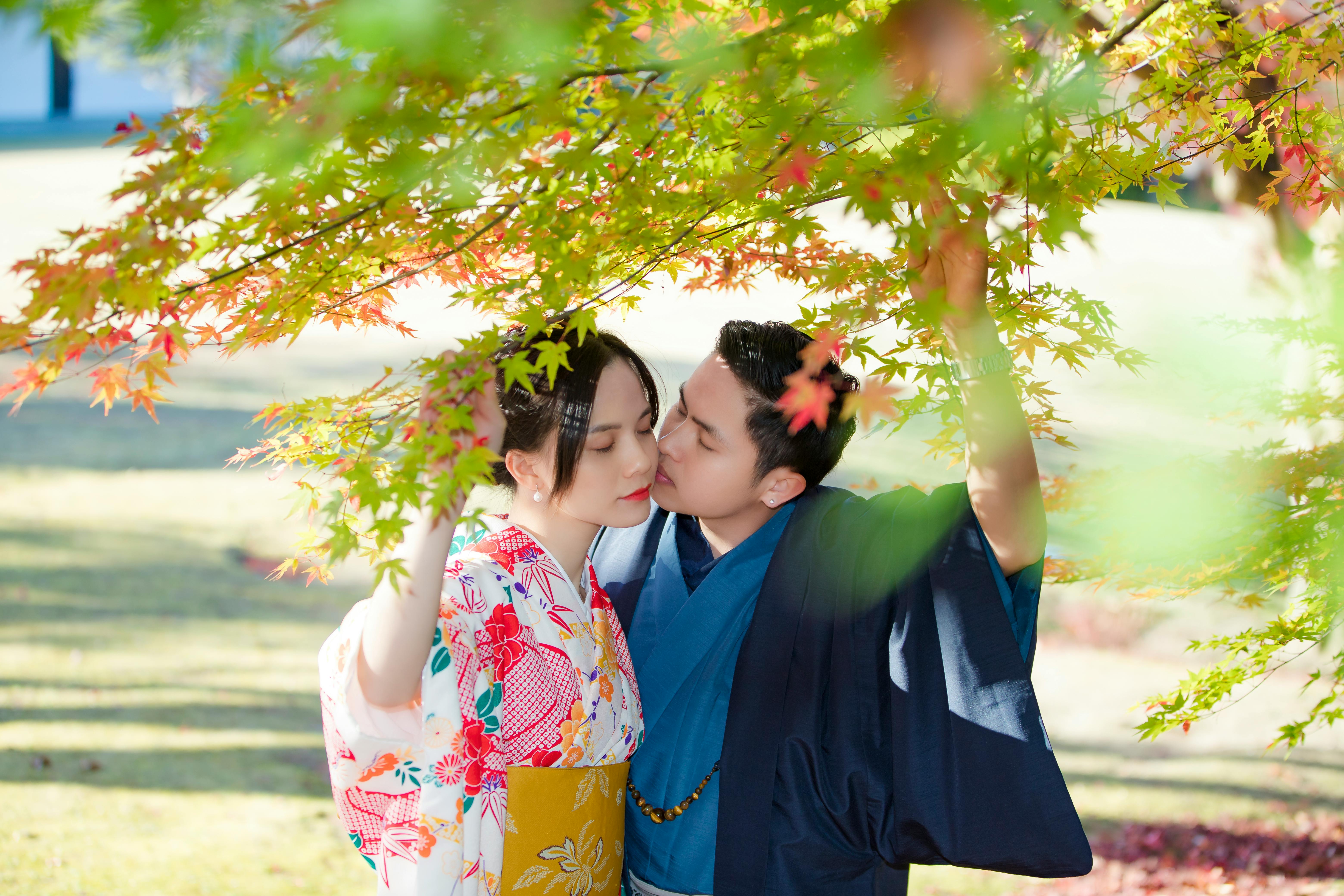 A Couple Wearing Hanfu Dress Standing Face to Face while Looking at ...