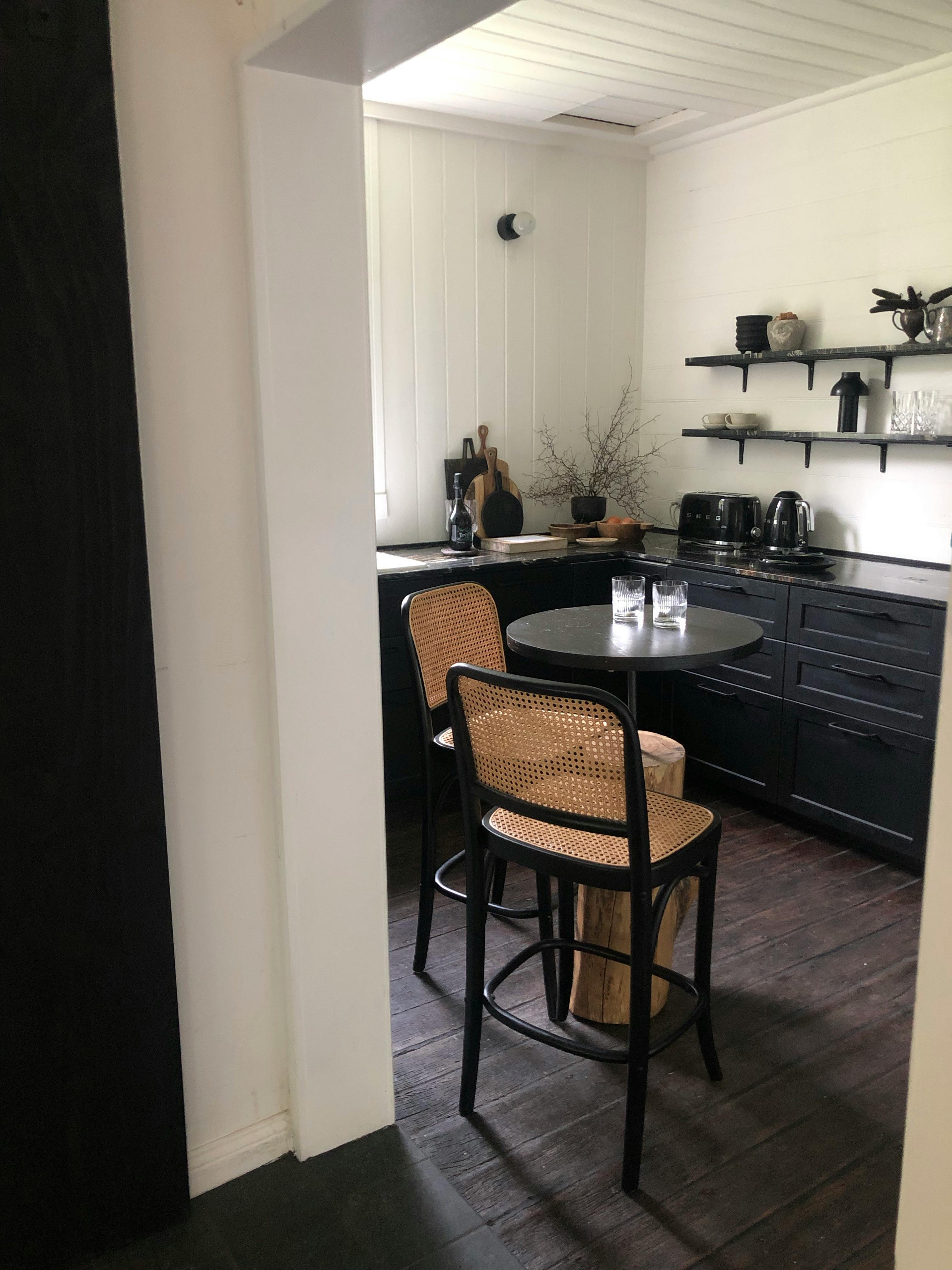 Round Brown Wooden Table Between Two Chairs and Ottoman Chair · Free ...