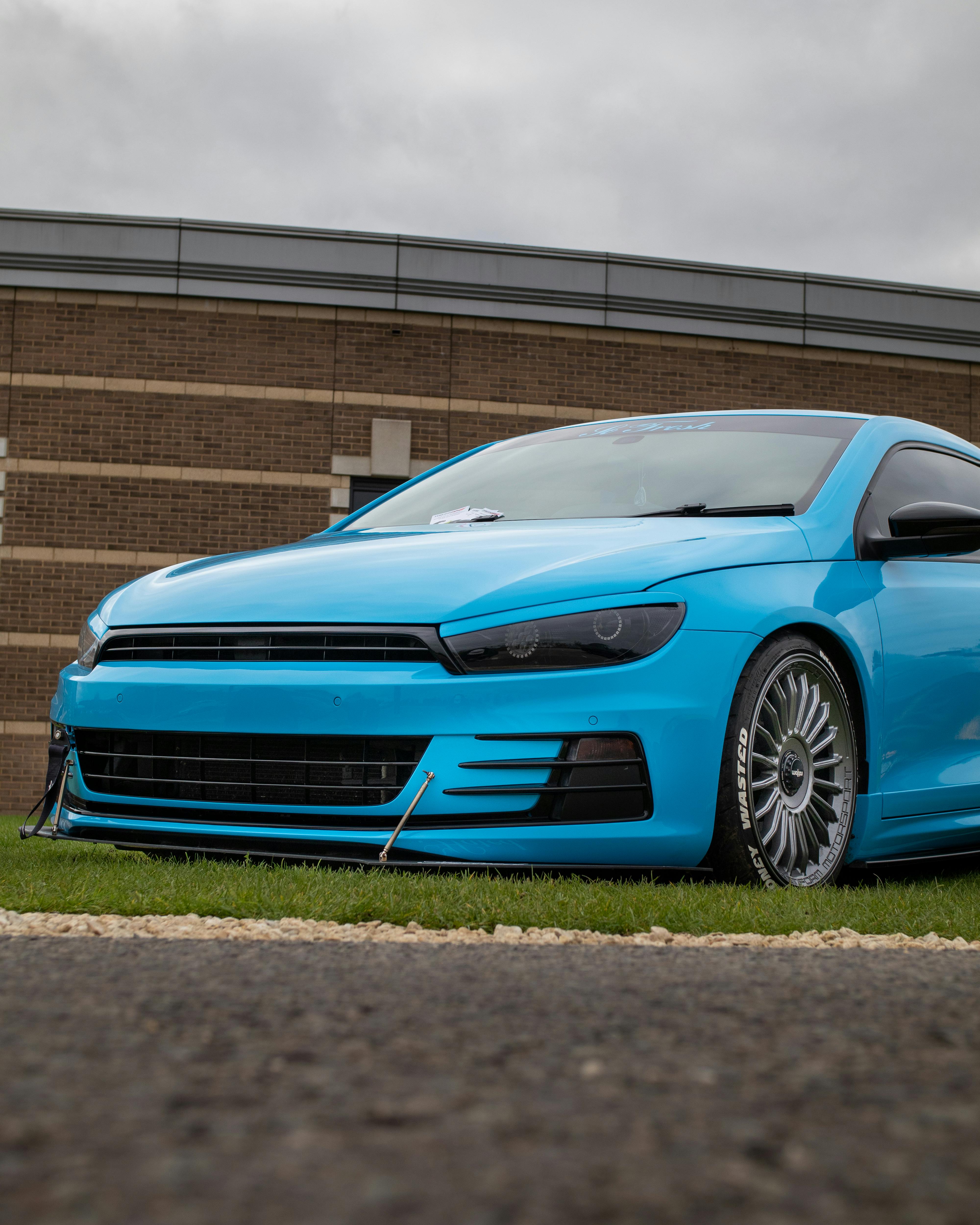 Blue Car on Grass · Free Stock Photo