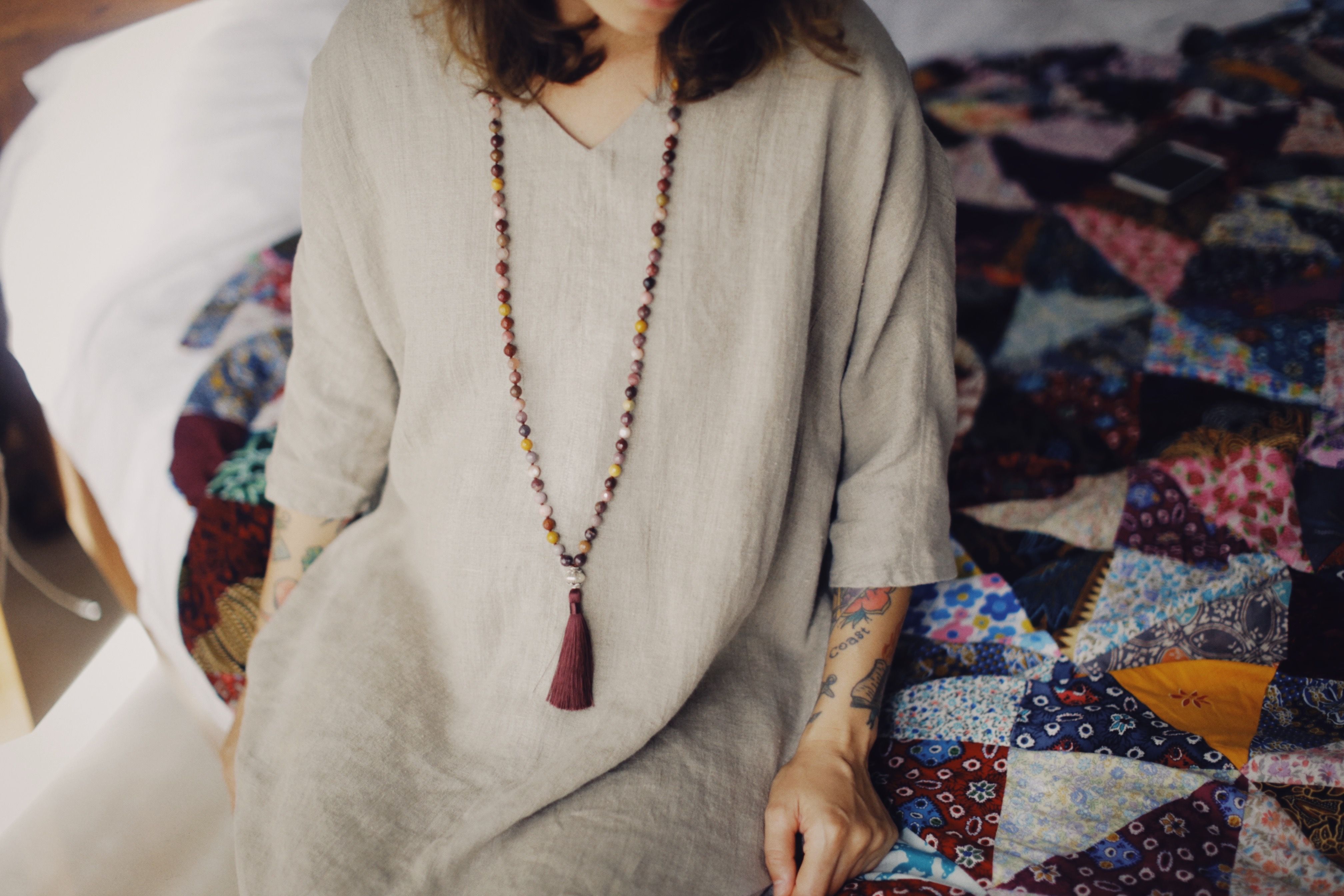 Woman in Robes Sitting on Bed · Free Stock Photo
