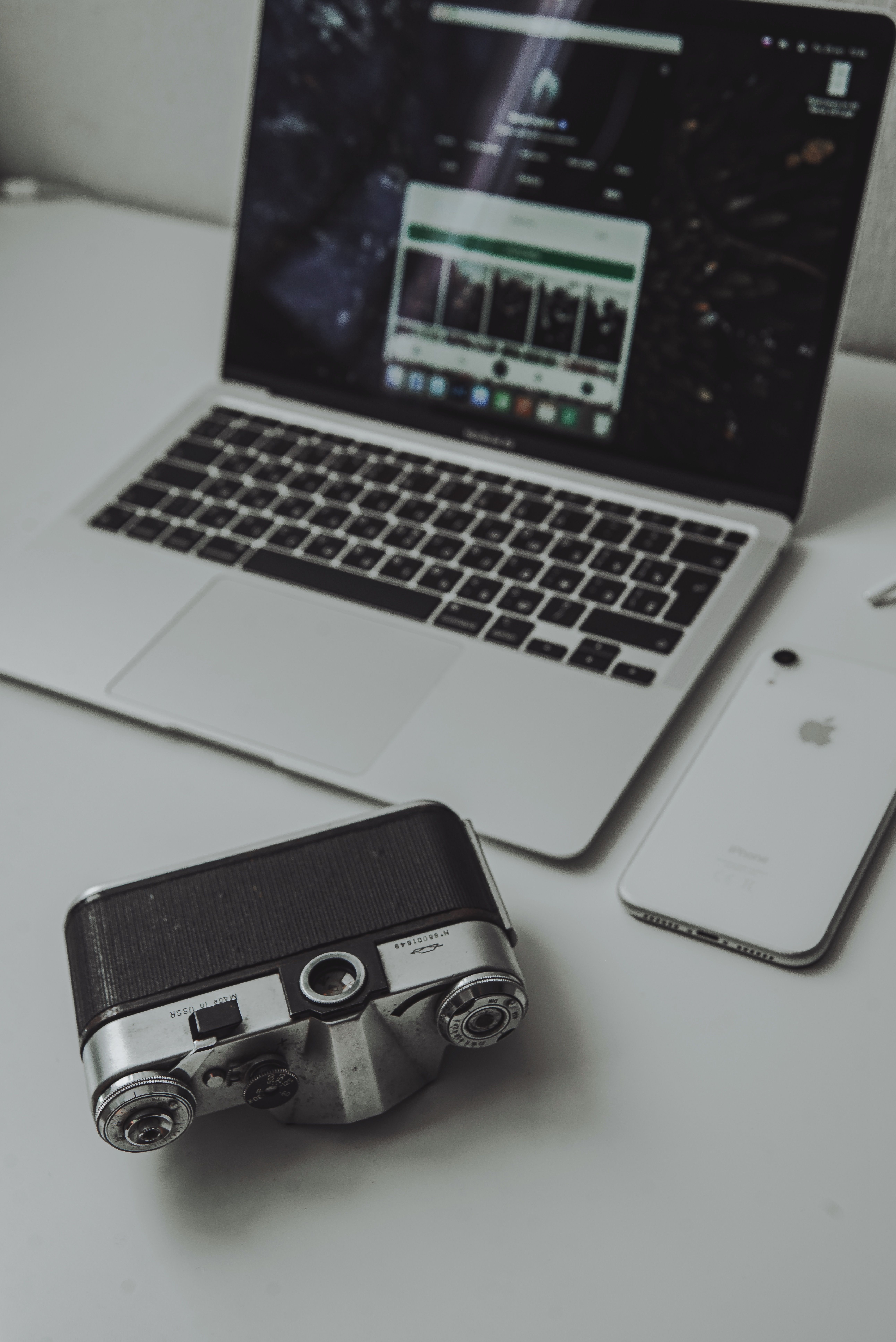 Analog Camera, Laptop and Phone on Desk · Free Stock Photo
