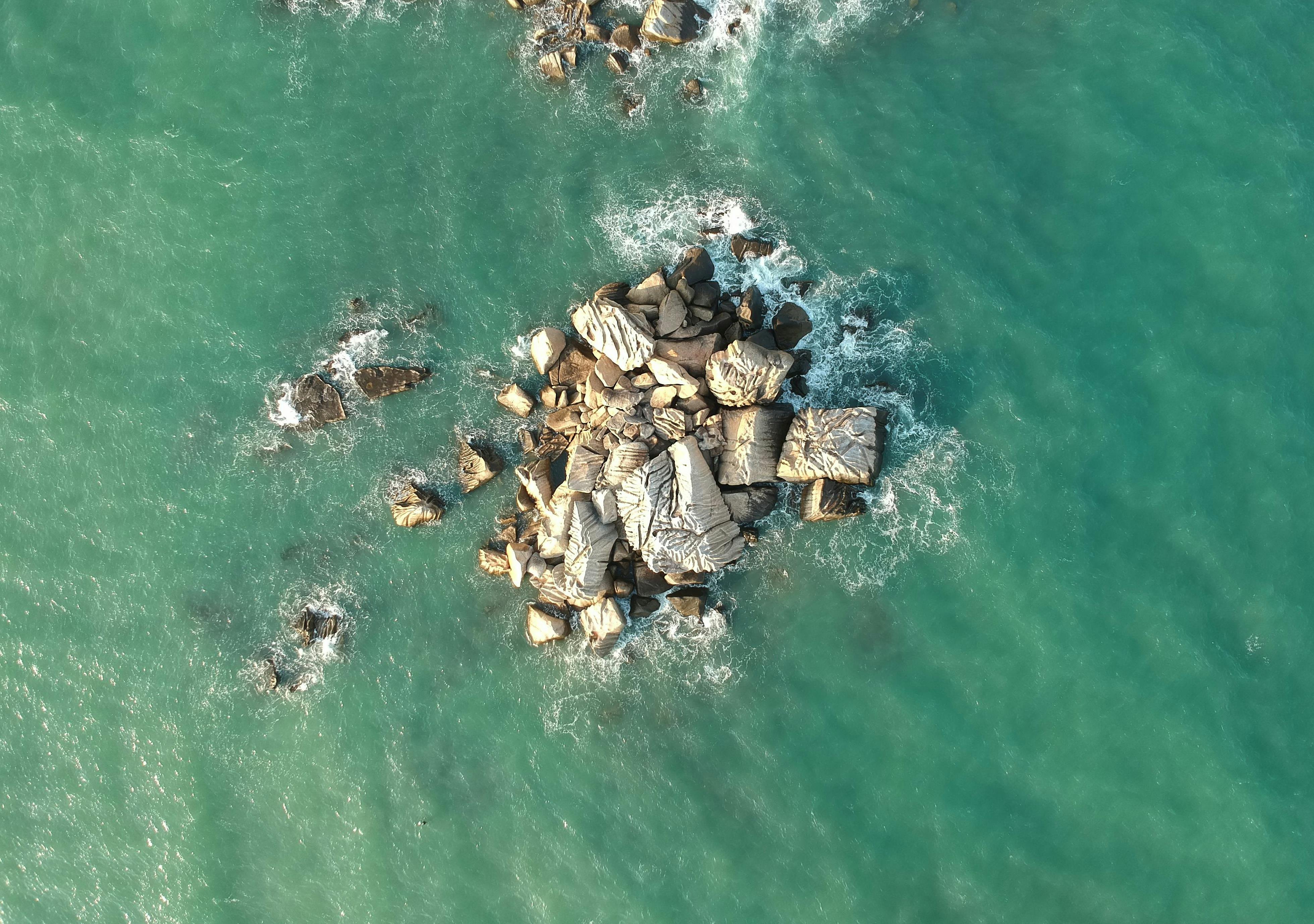 Top View of Rock Formations Surrounded by Water · Free Stock Photo