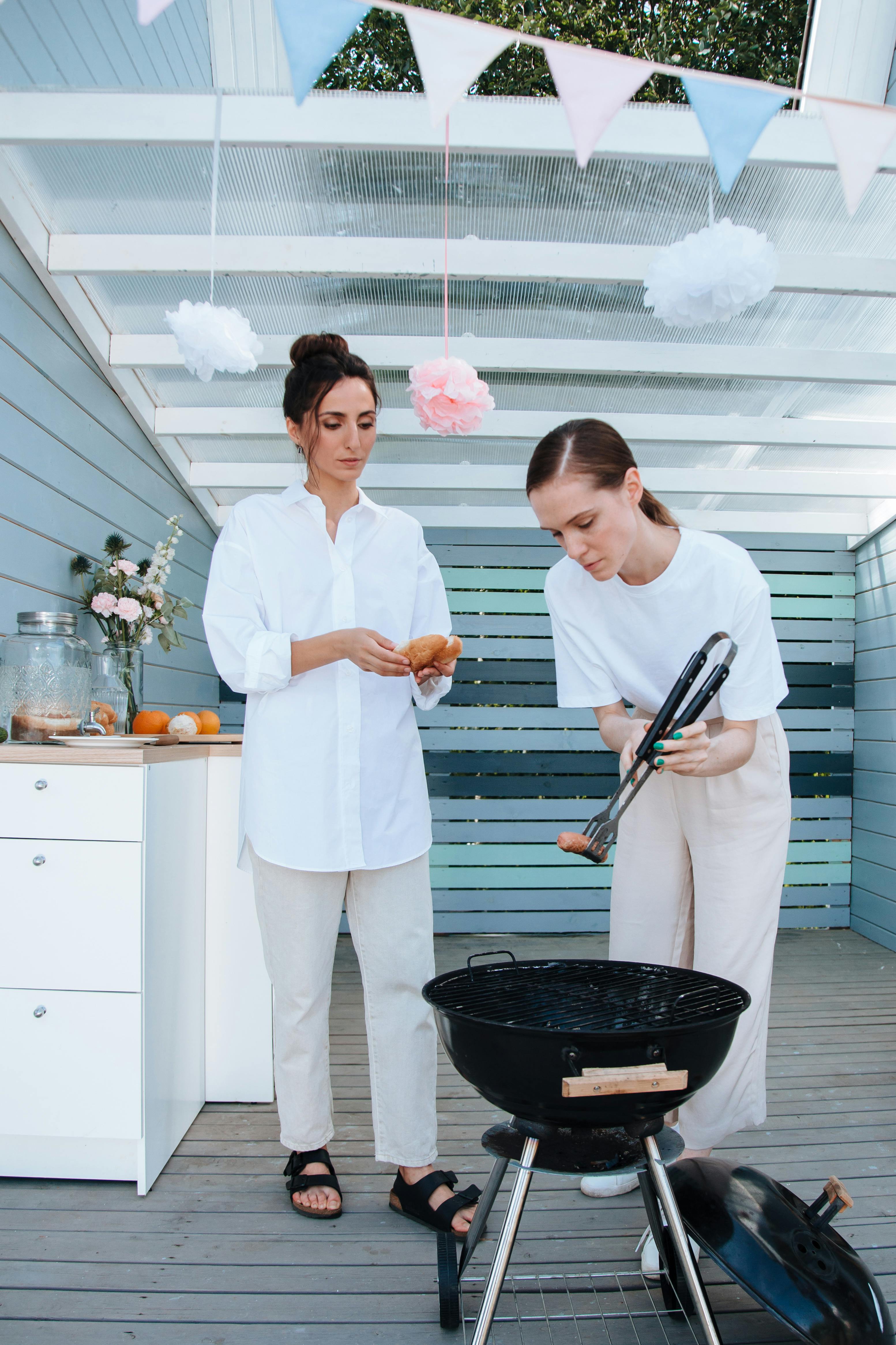 A Father Grilling Outdoors With His Son · Free Stock Photo