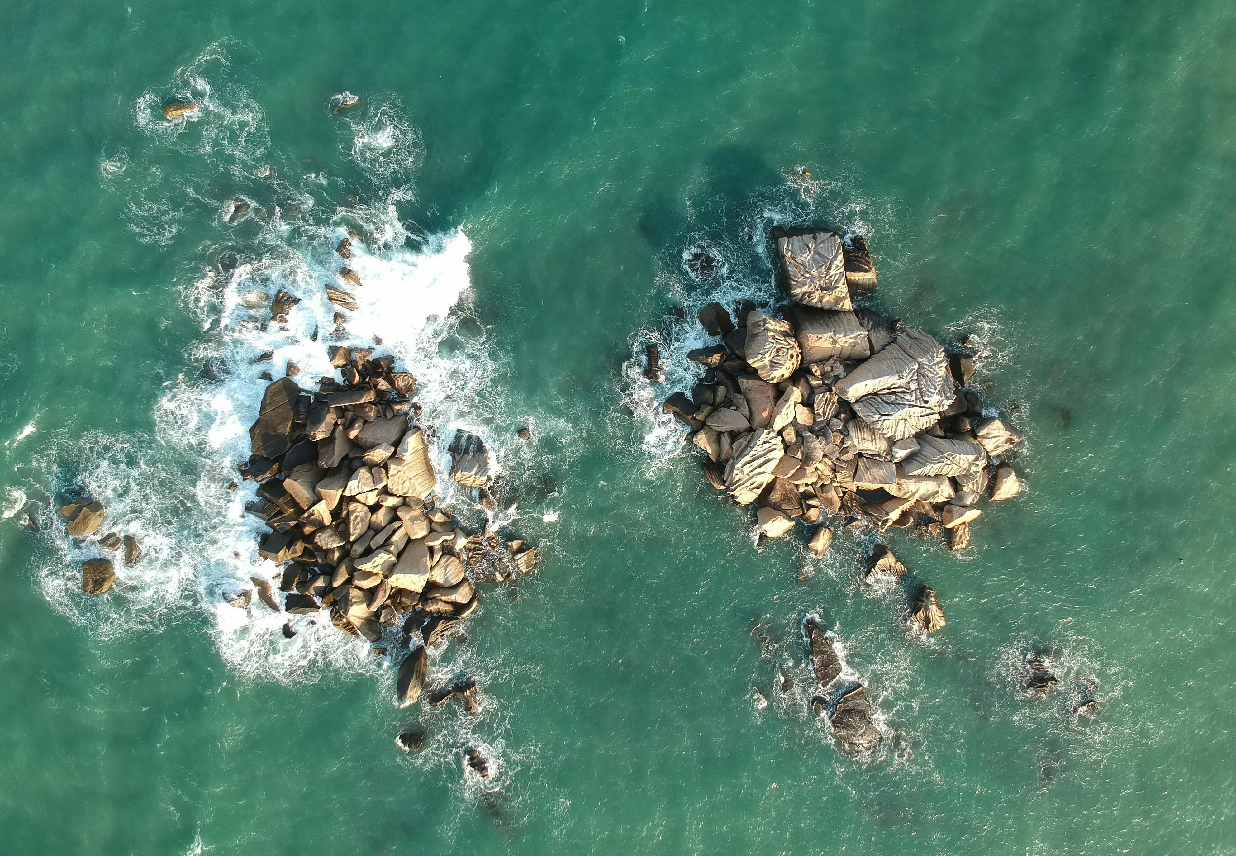 Bird's Eye View of Rocks In Ocean · Free Stock Photo