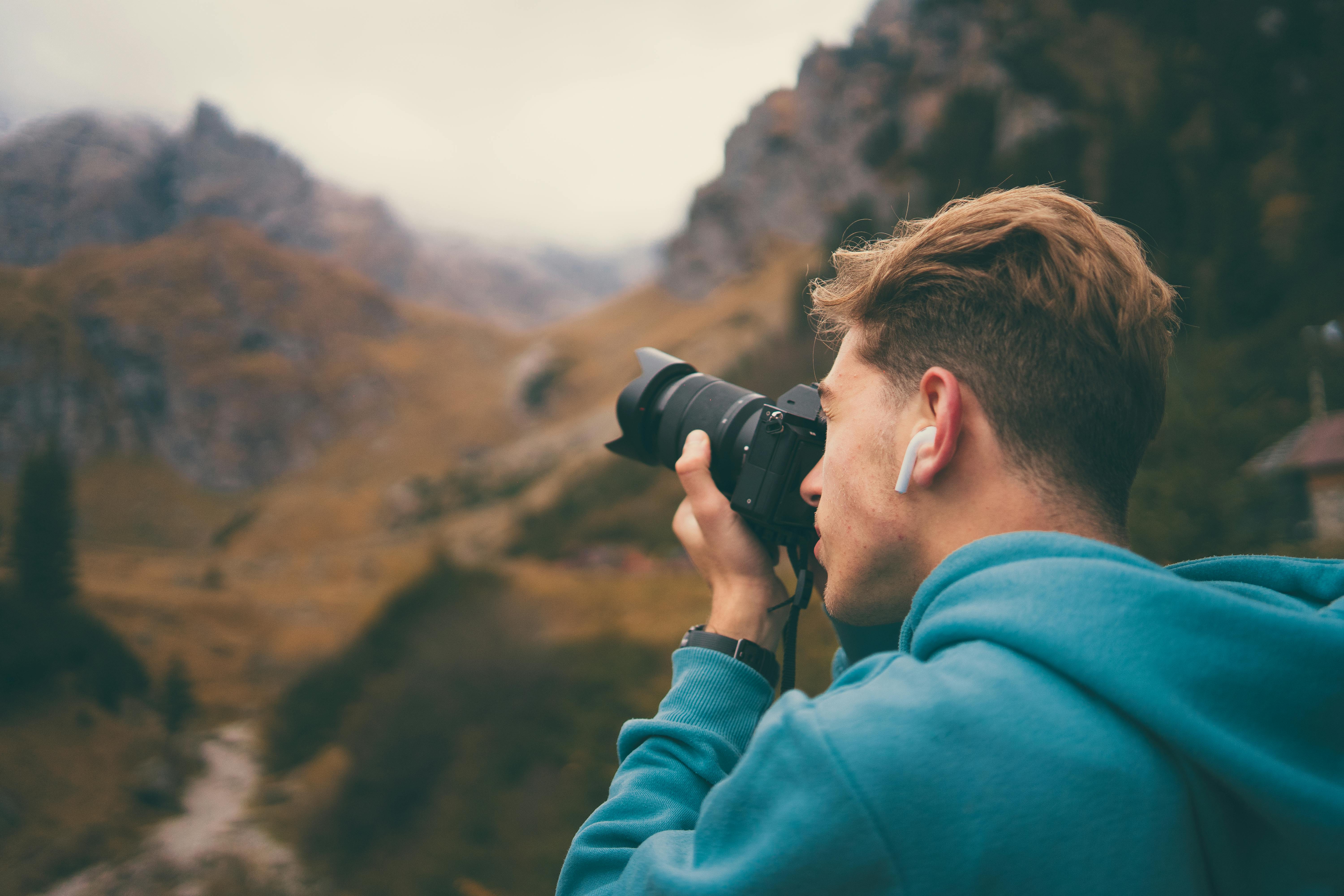 Person Holding Camera · Free Stock Photo