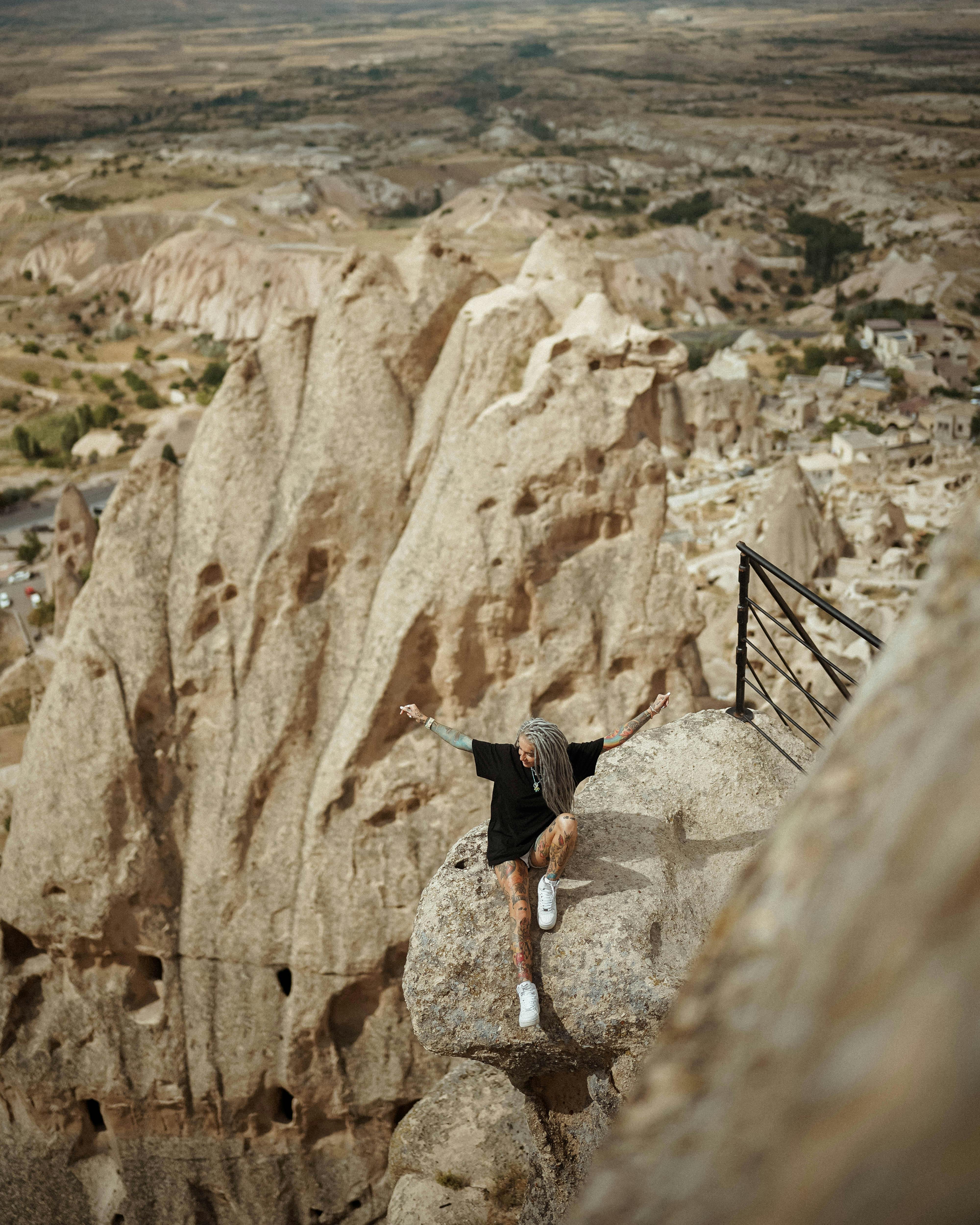 Person Standing on a Rock Stocked Between Rocks · Free Stock Photo