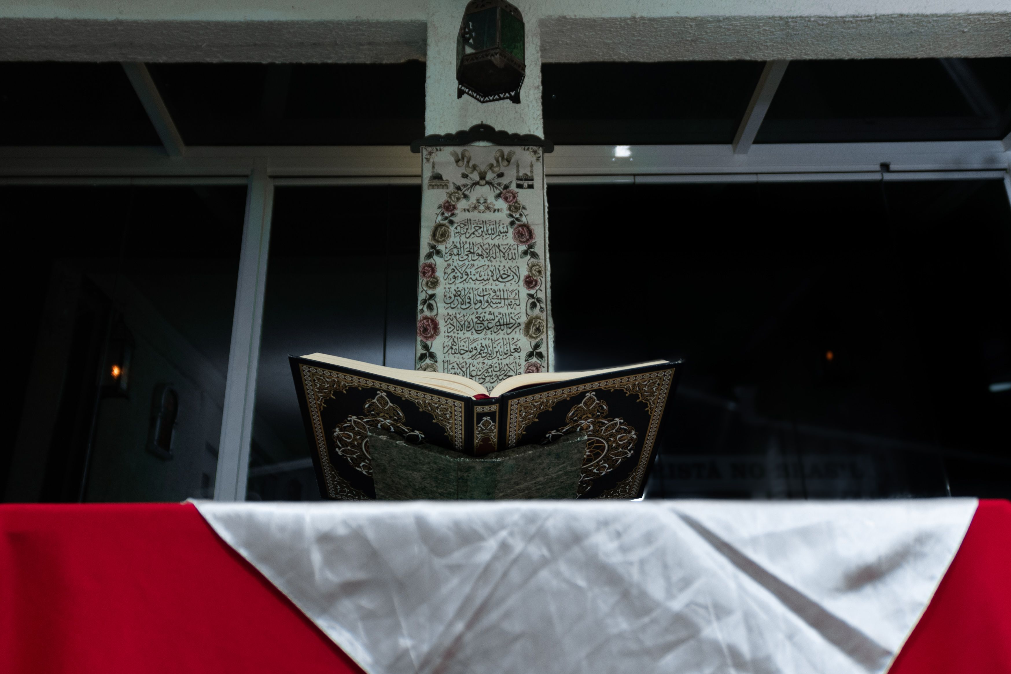 Open Koran and Writings on Wall · Free Stock Photo