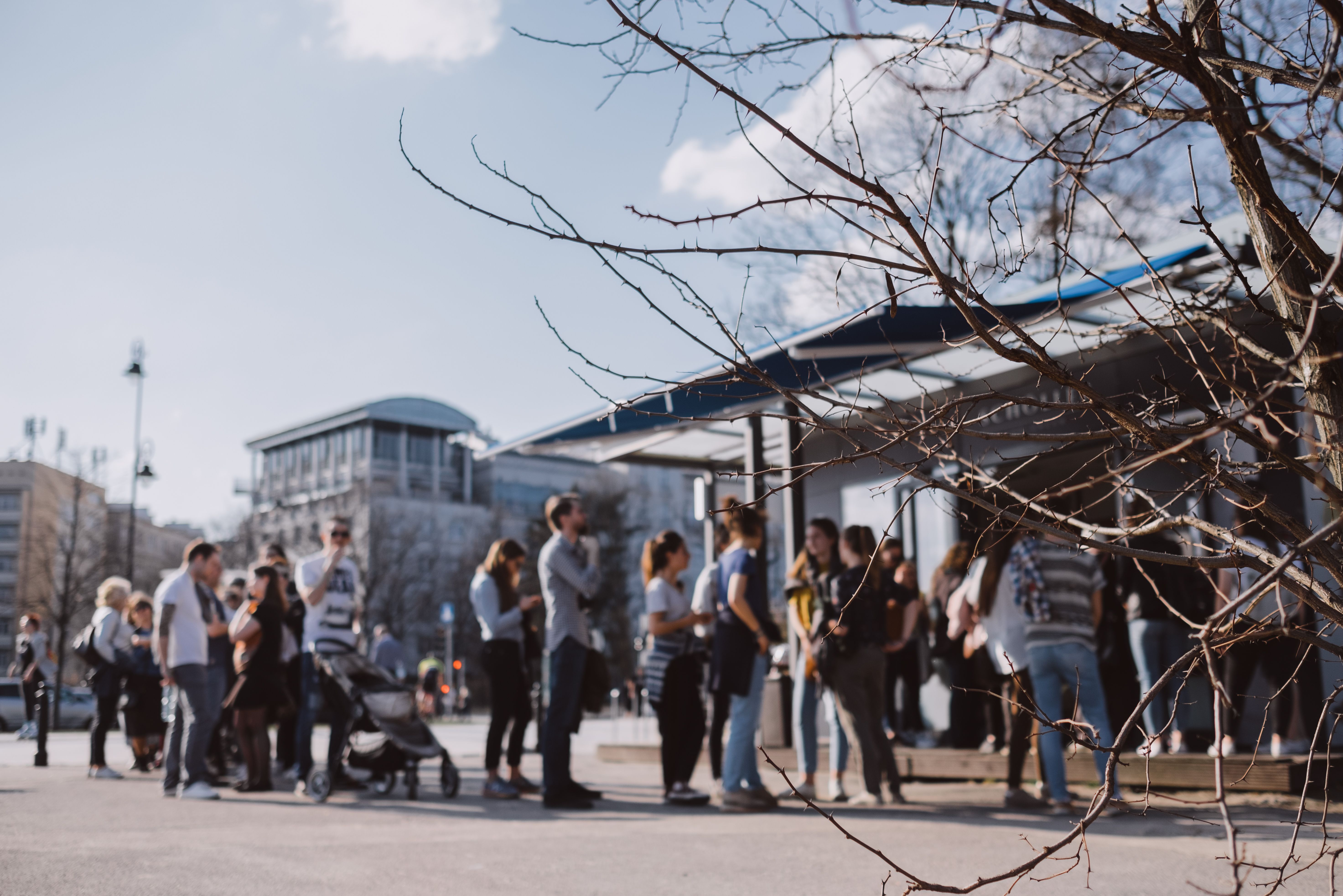 Blury Photograph of People Beside White Building · Free Stock Photo
