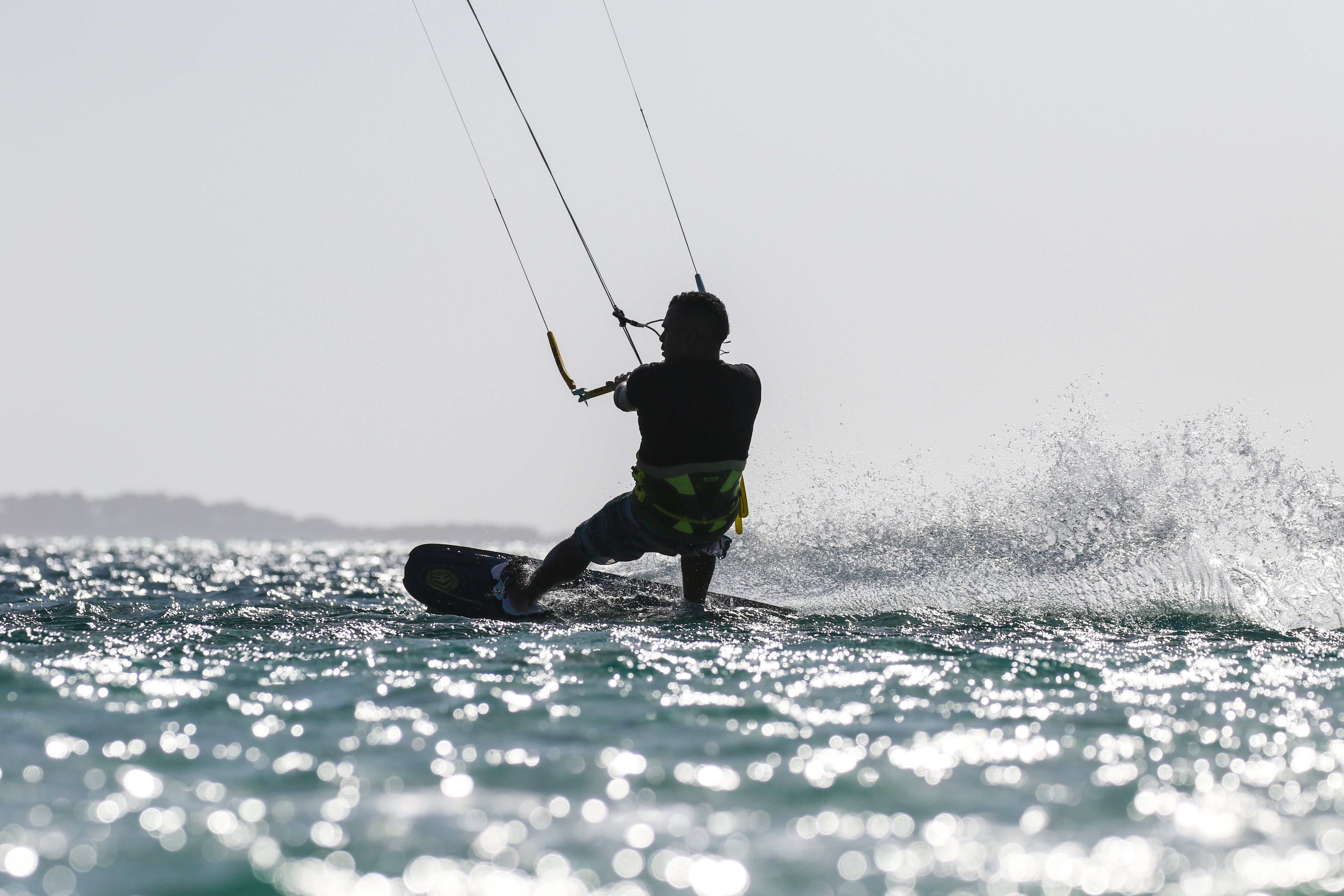 A Man Kiteboarding on a Body of Water · Free Stock Photo