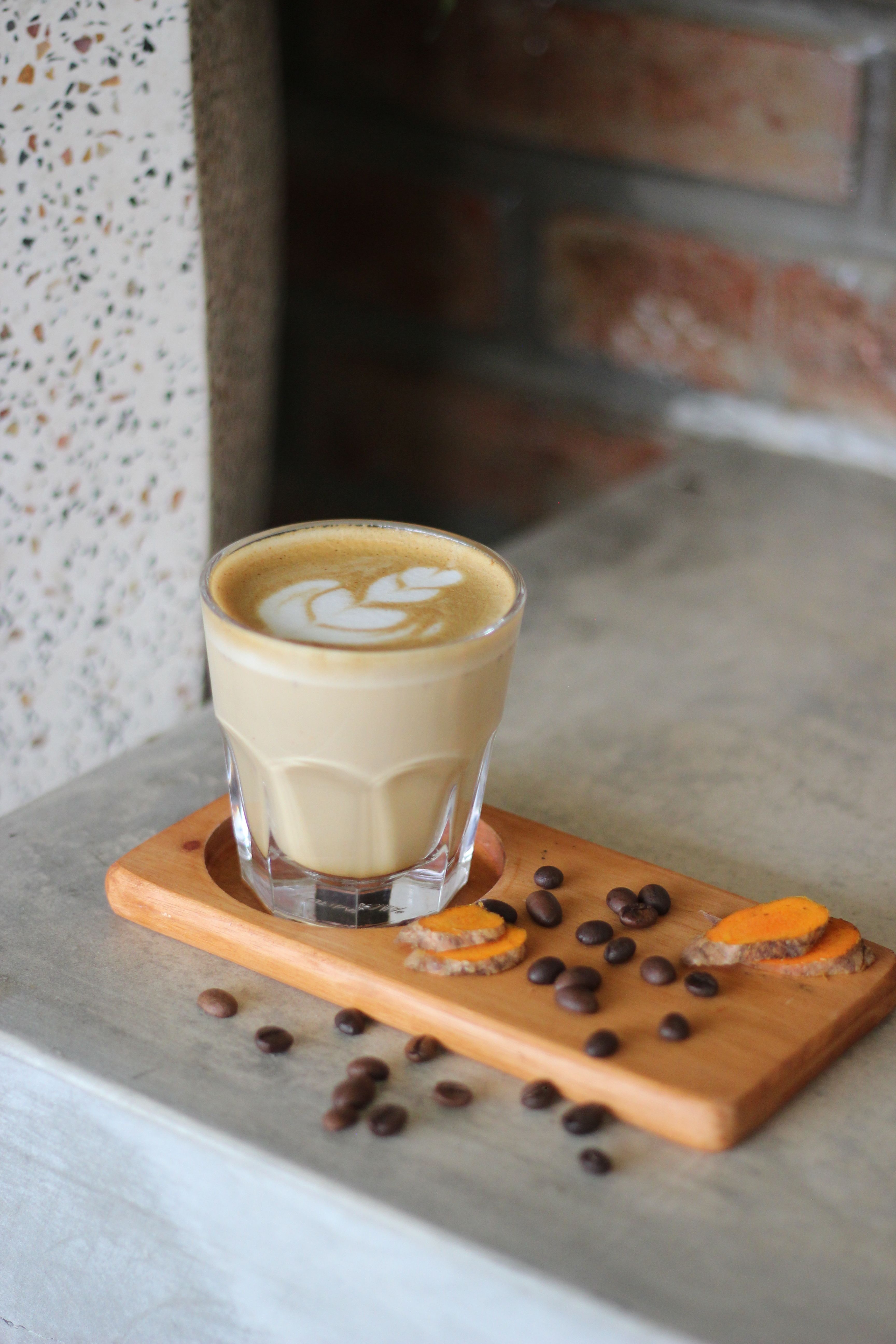 Coffee Latte with Frothy Milk in Tall Glass · Free Stock Photo