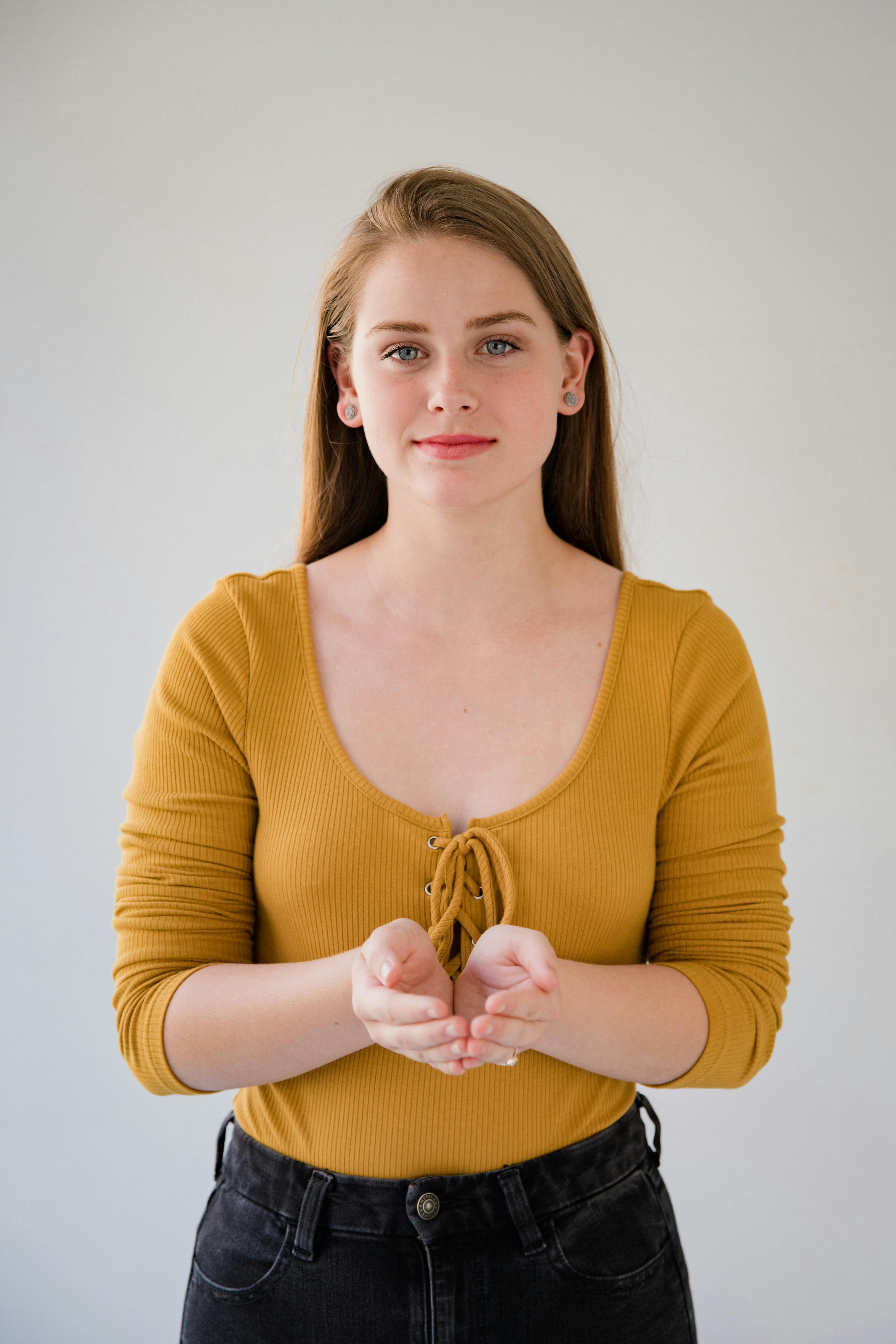 Young Woman Showing Sign Language Signs · Free Stock Photo