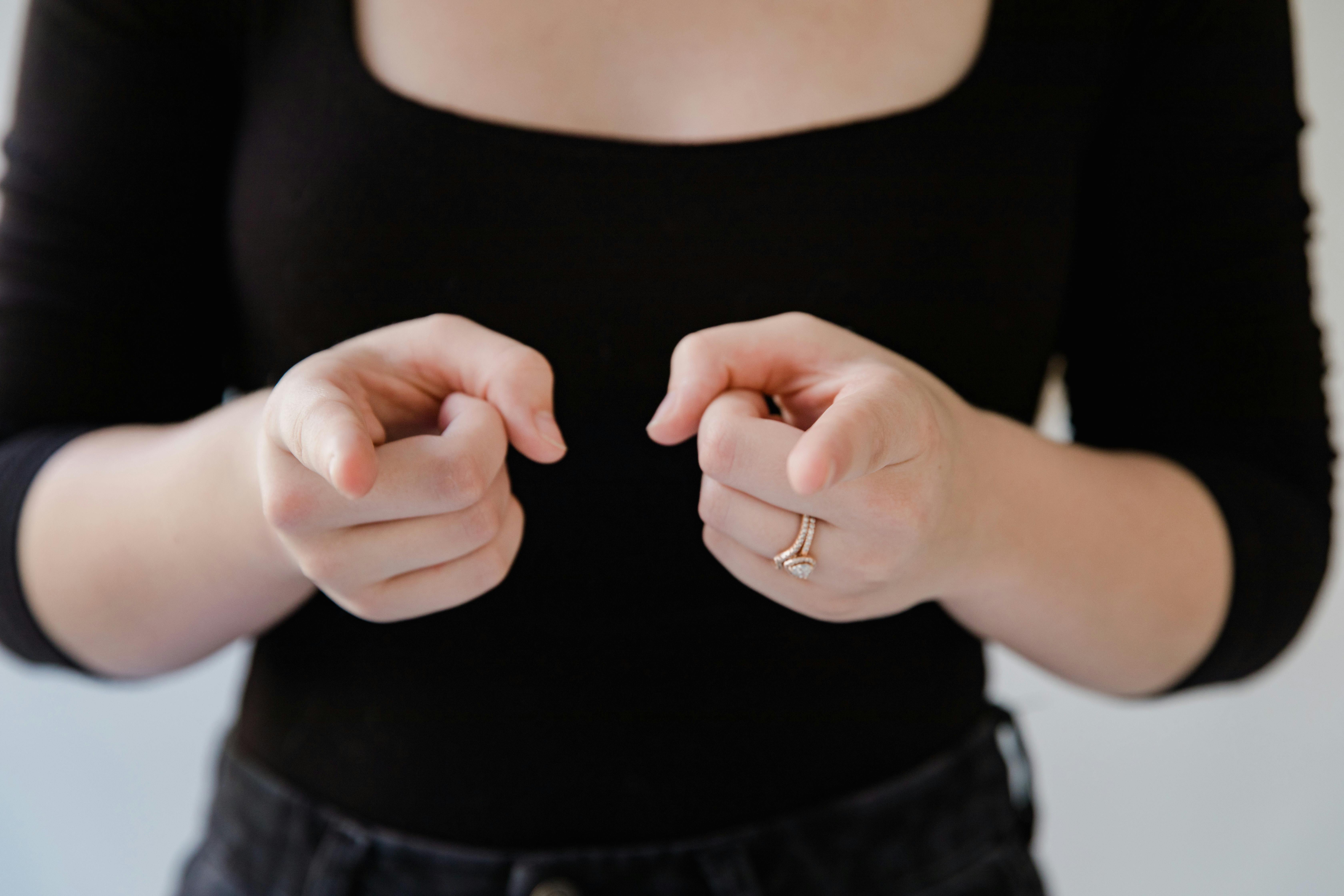 Close up on Womans Hands Showing Sign Language Signs · Free Stock Photo