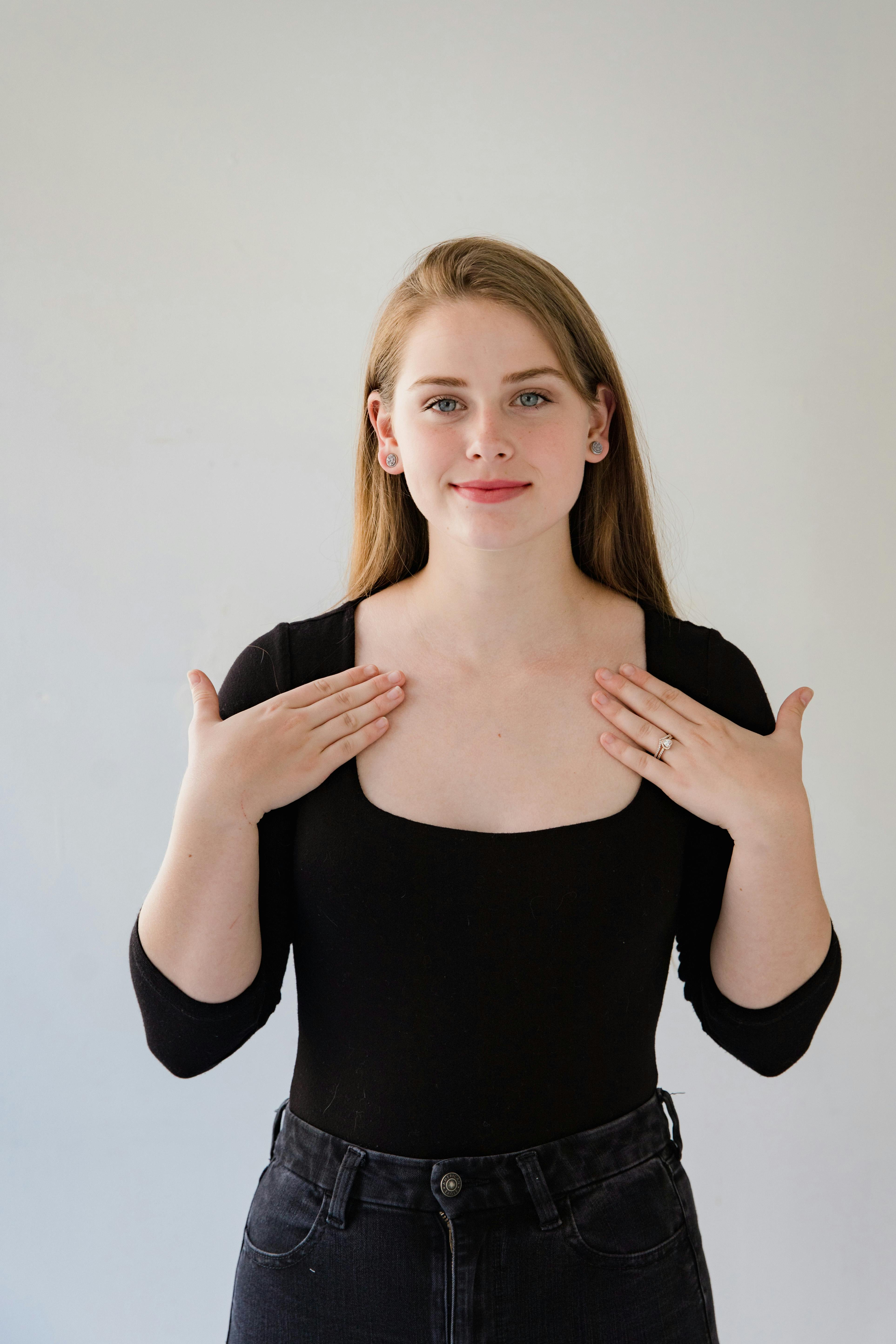 Young Woman Showing Sign Language · Free Stock Photo