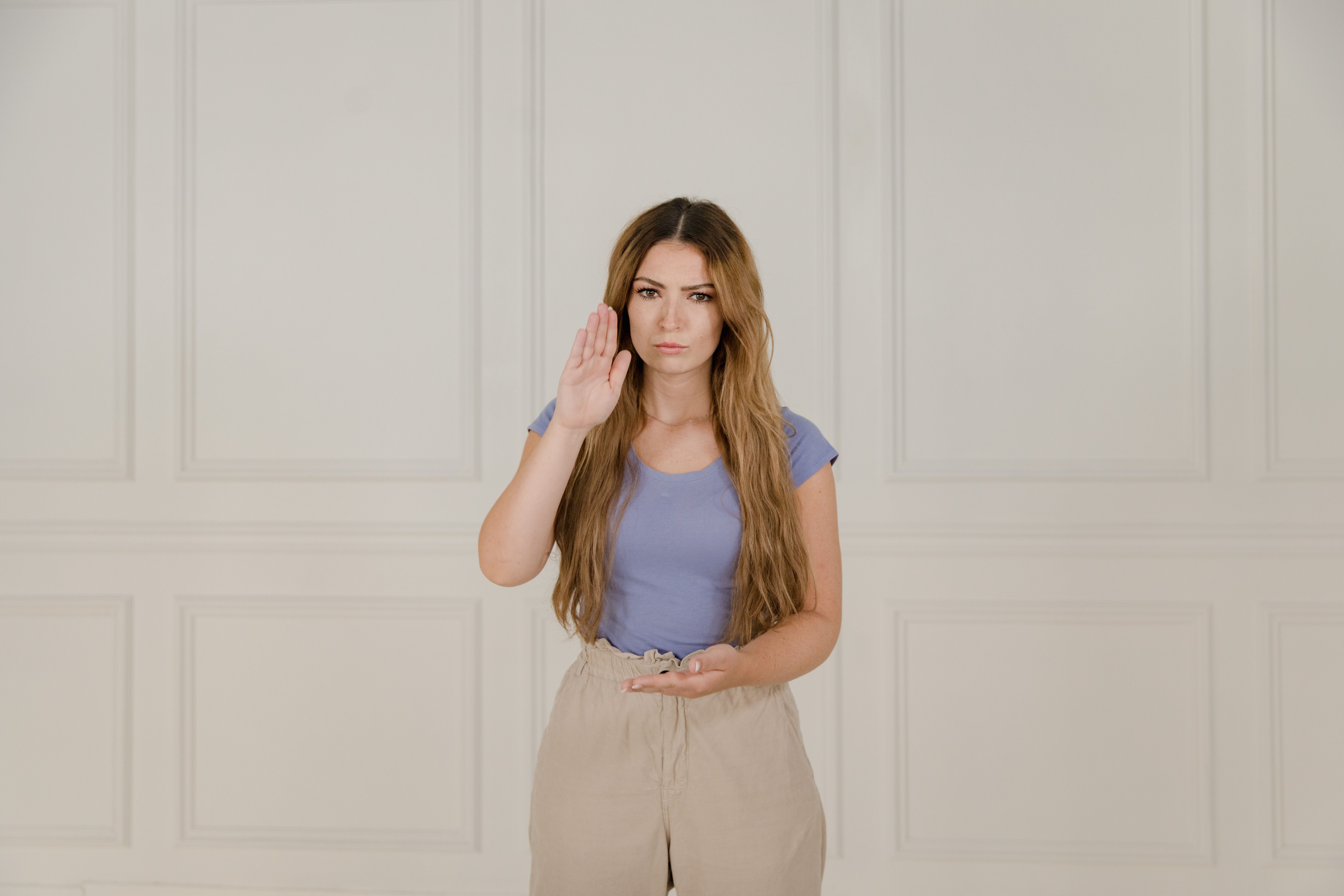 Portrait of Woman Showing Sign Language · Free Stock Photo