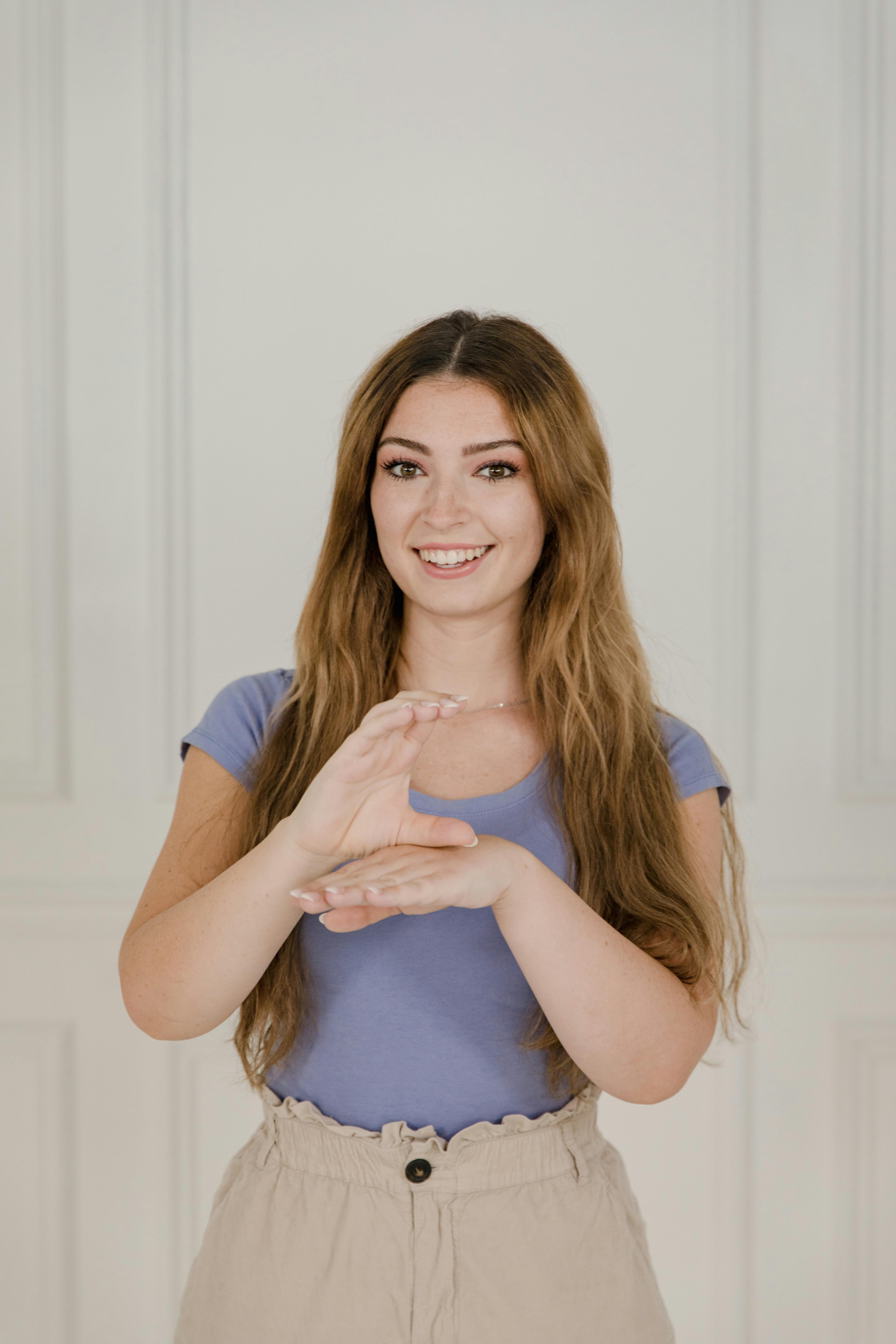 Young Woman Showing Sign Language Signs · Free Stock Photo
