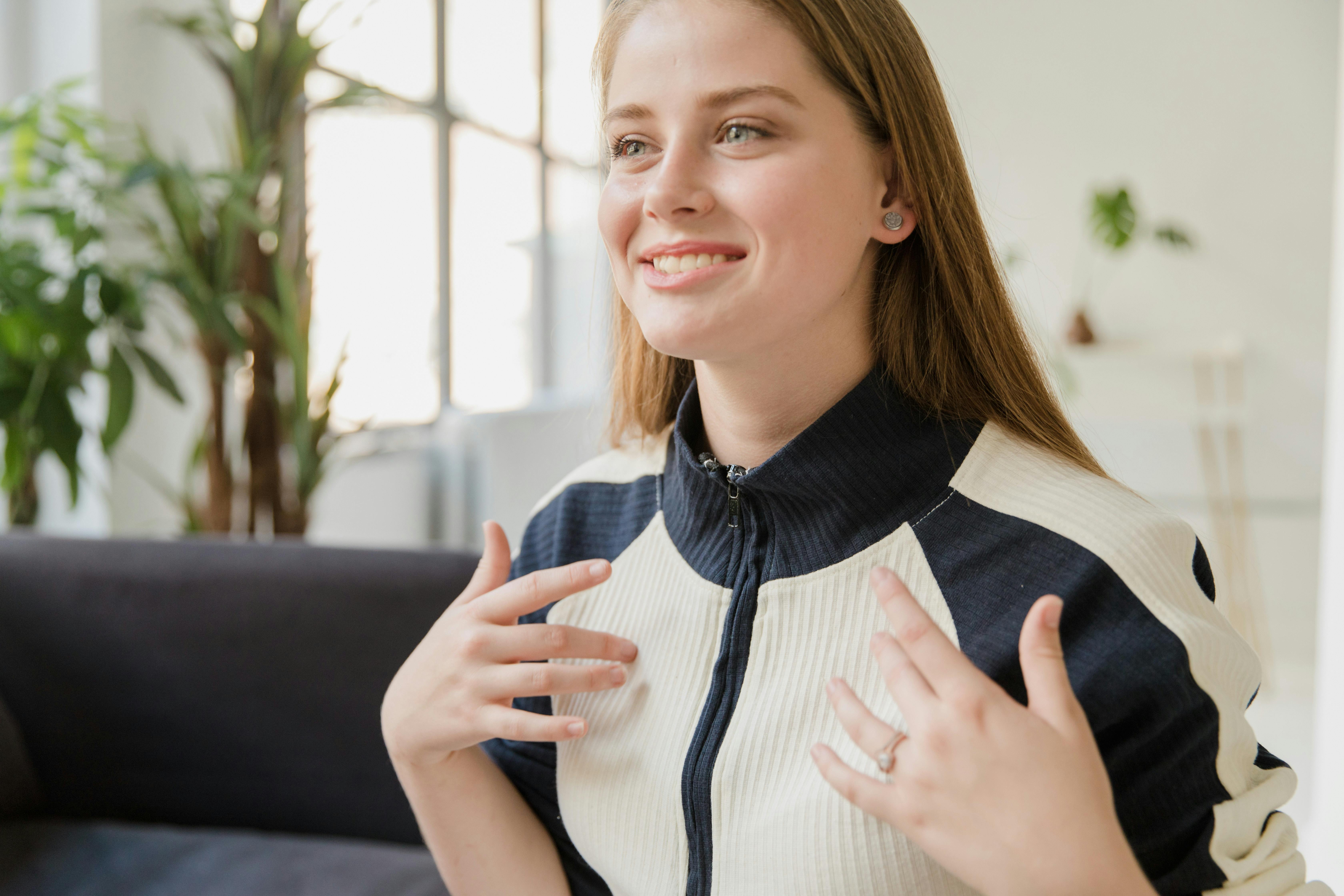 Young Woman Using Sign Language · Free Stock Photo