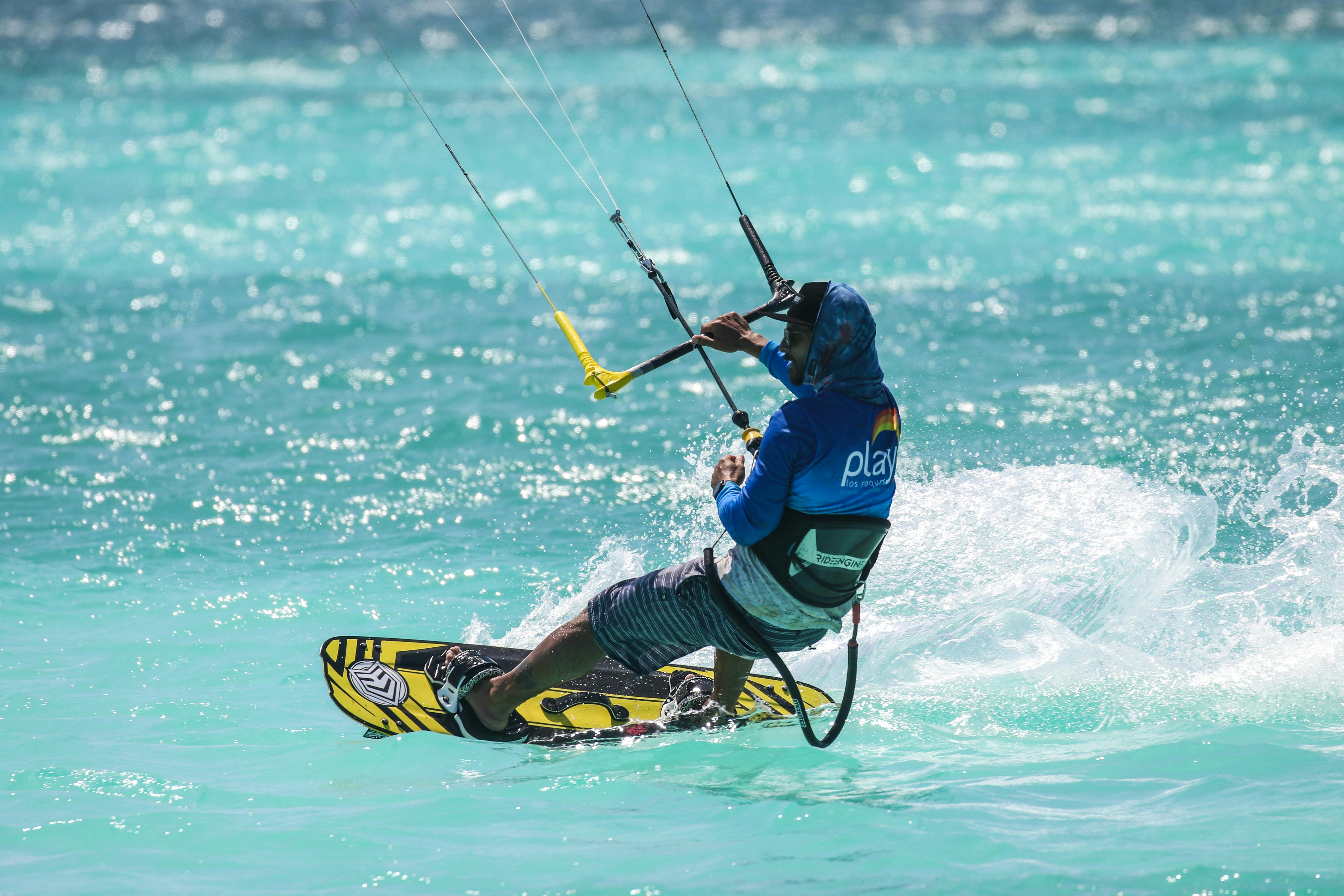 Man Kite Surfing in Blue Sea · Free Stock Photo