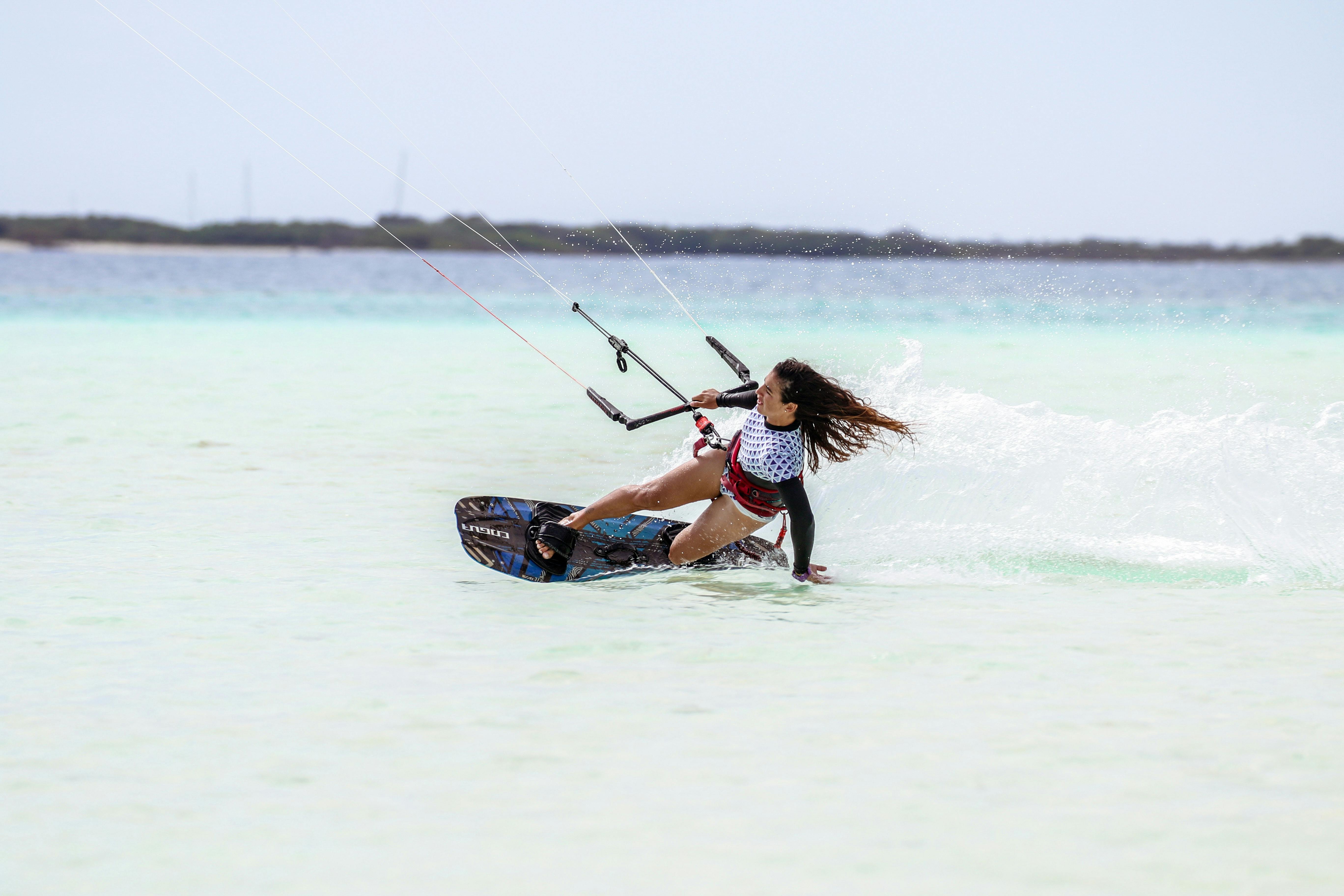 Woman Kitesurfing in Blue Sea · Free Stock Photo