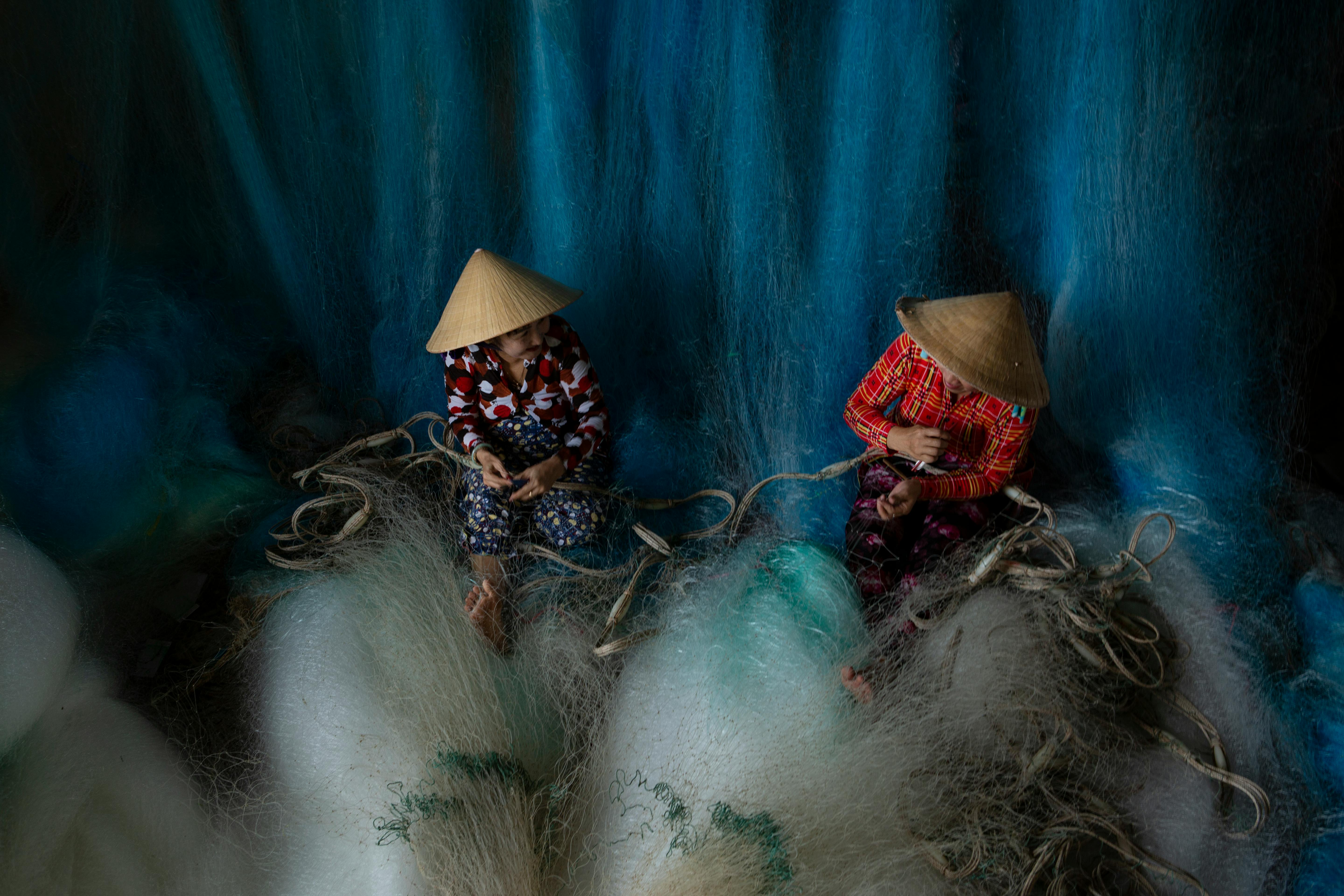 Women Weaving Fishing Nets · Free Stock Photo