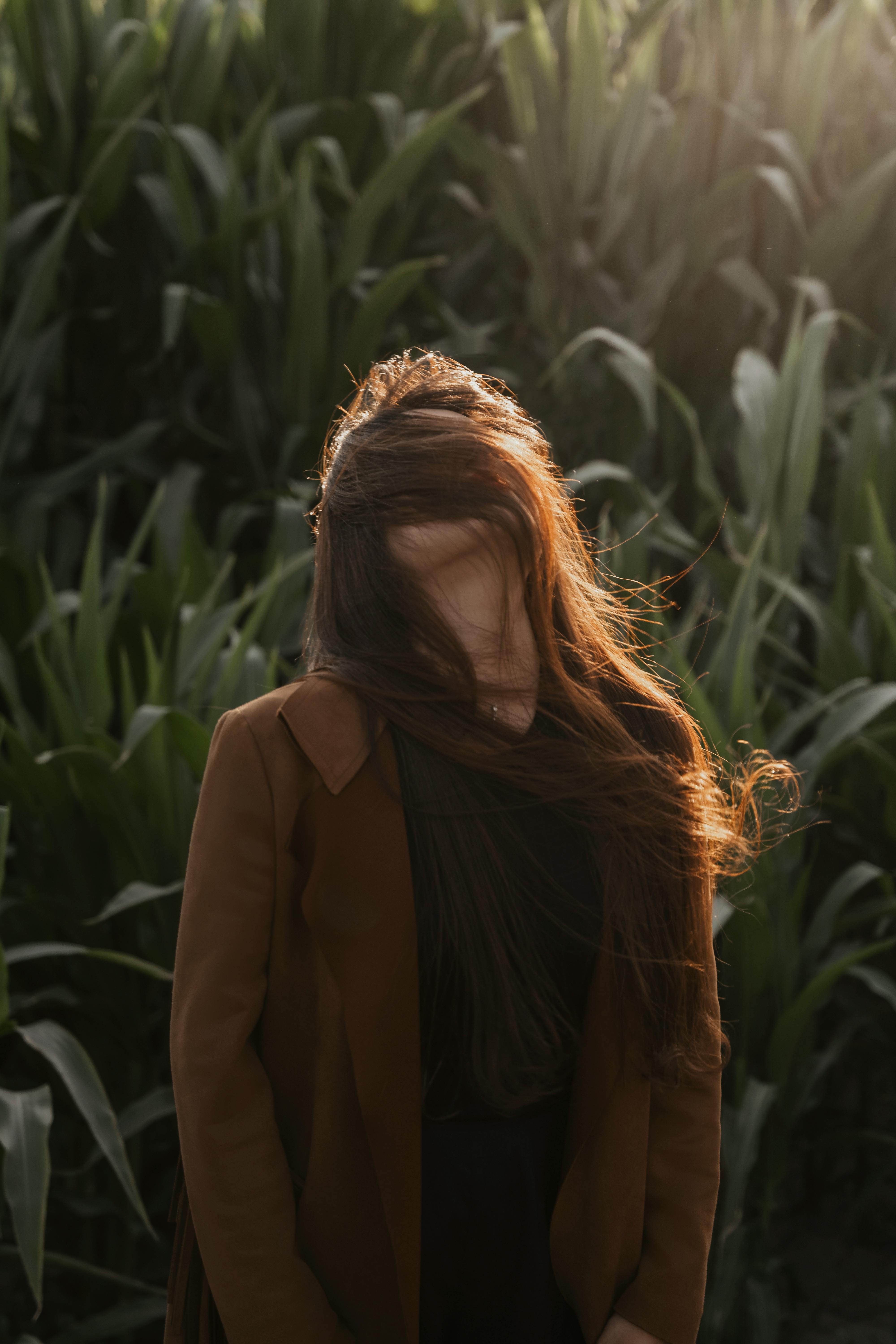 Portrait of Woman with Hair Covering her Face · Free Stock Photo