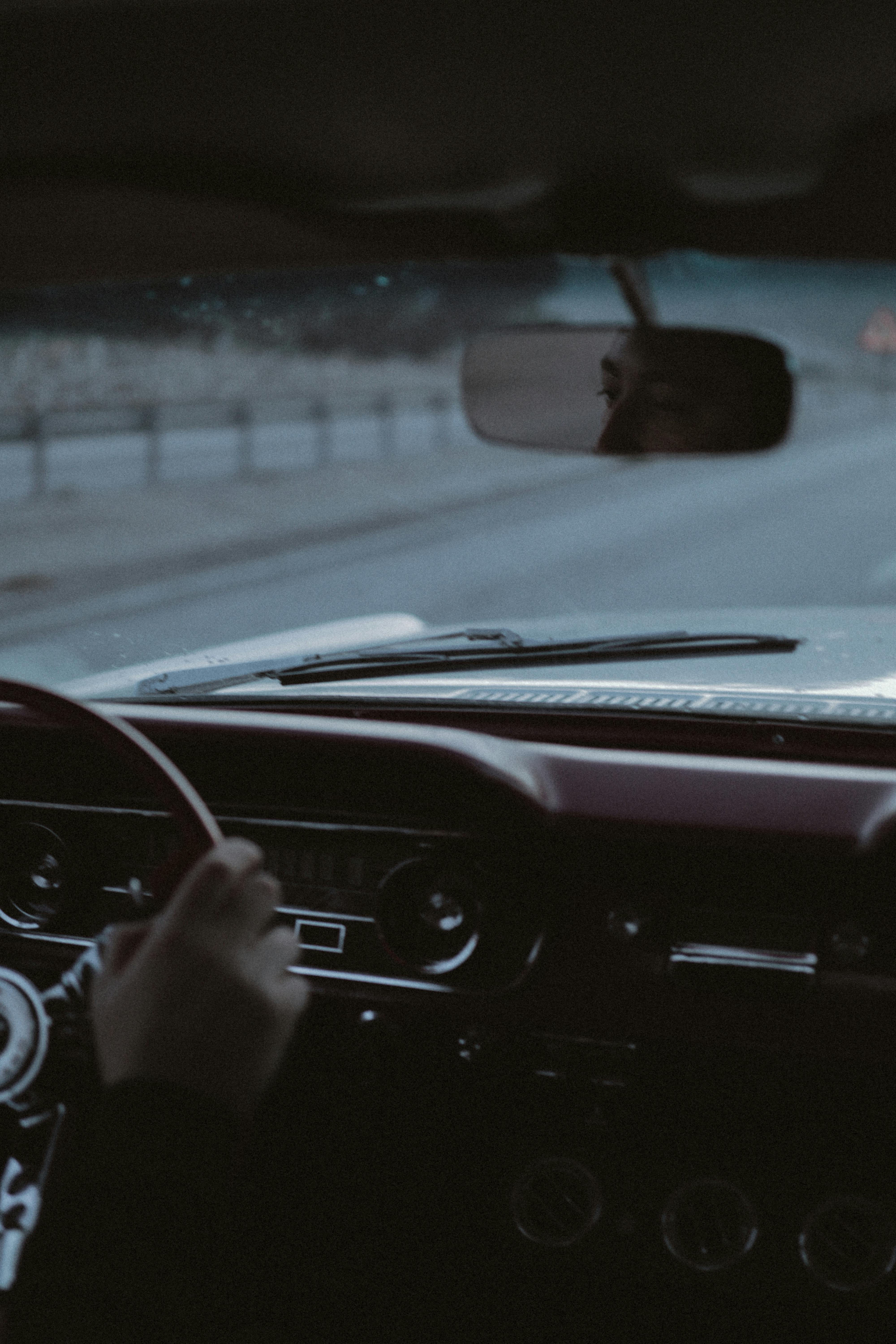 A Person Driving Car on Road · Free Stock Photo
