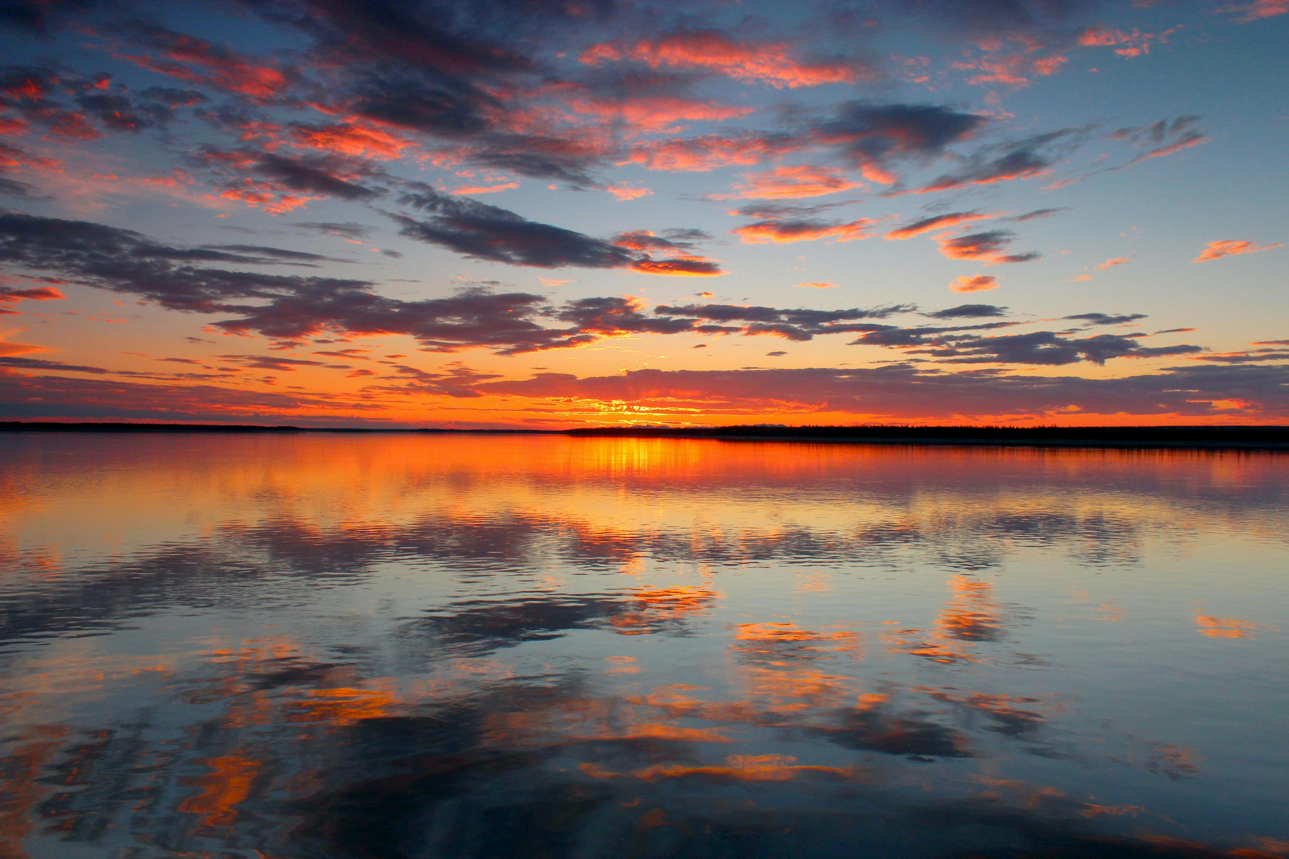 Reflection of the Sky During Golden Hour on Water Surface · Free Stock ...