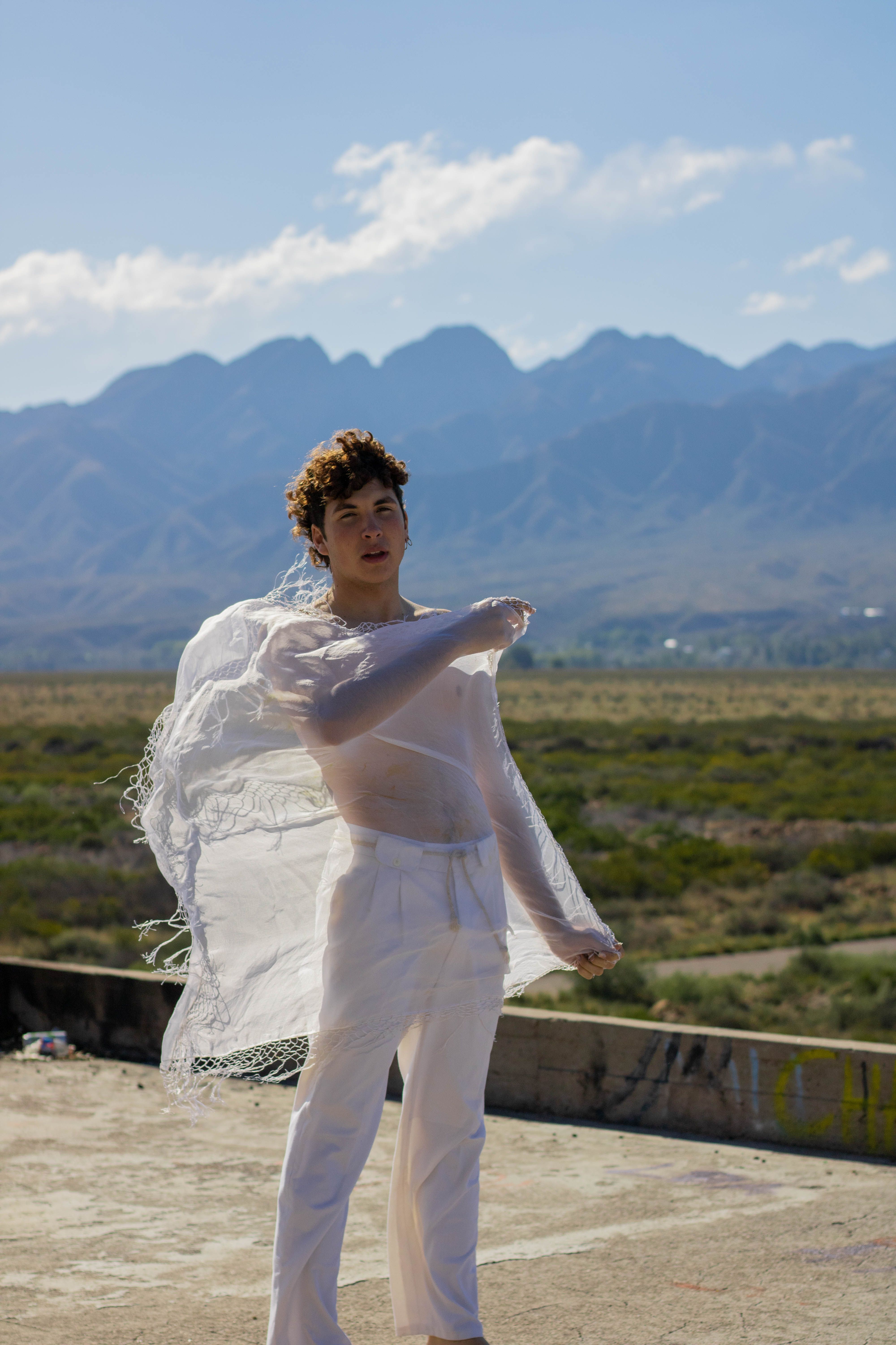 A Shirtless Man Covered with a Sheer Fabric · Free Stock Photo