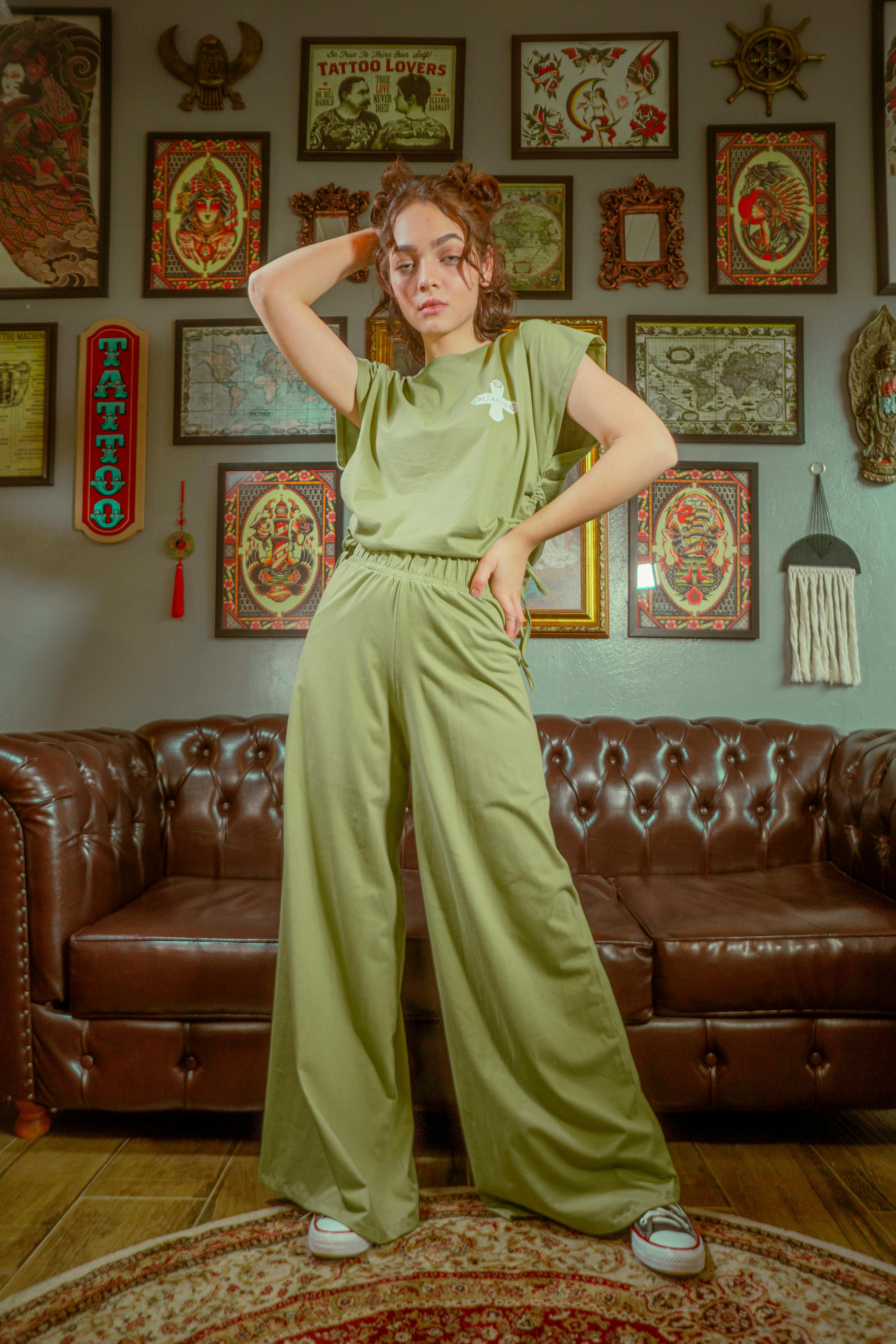 Woman Standing in Front of Leather Sofa · Free Stock Photo