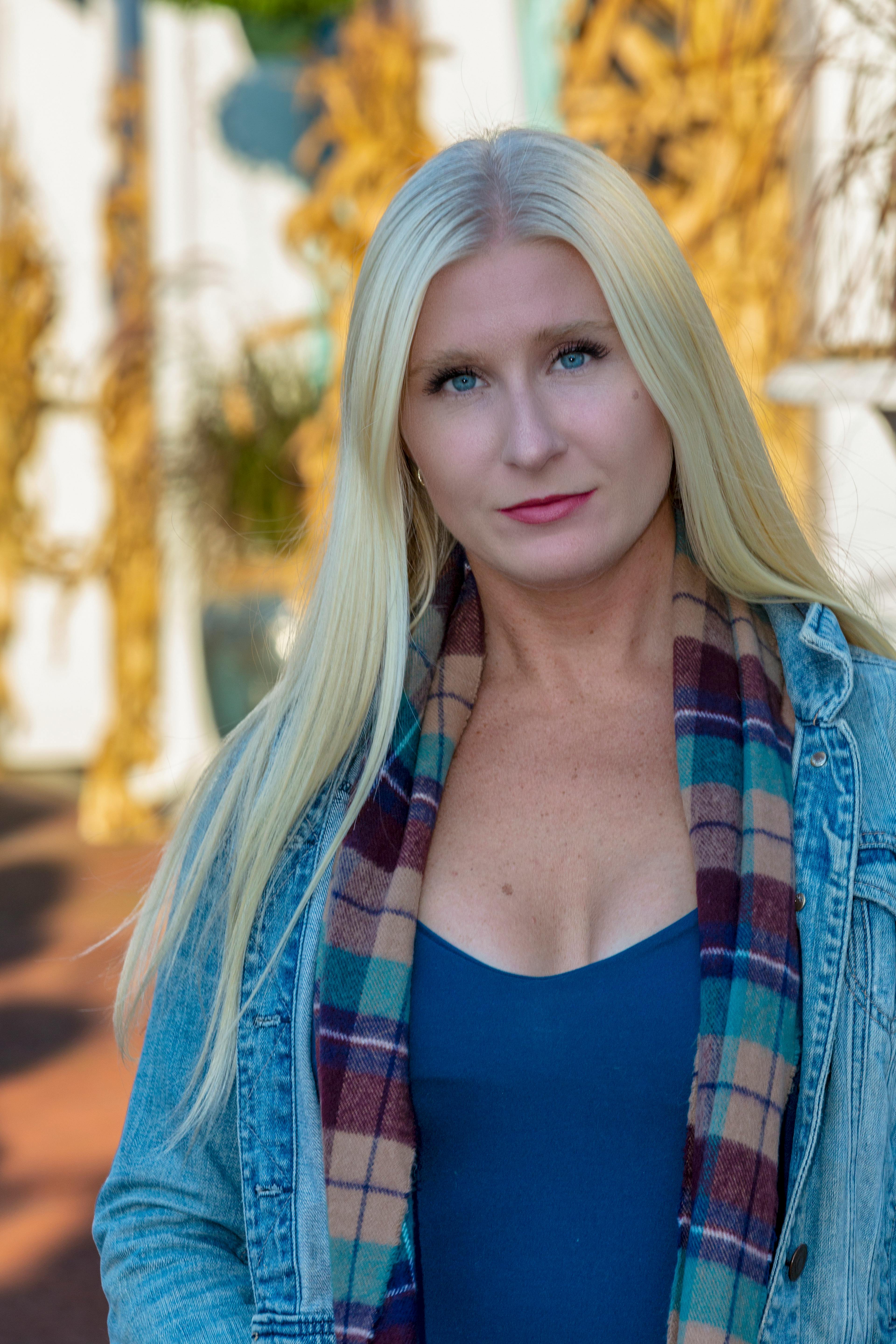Woman in Blue Jacket Smiling · Free Stock Photo