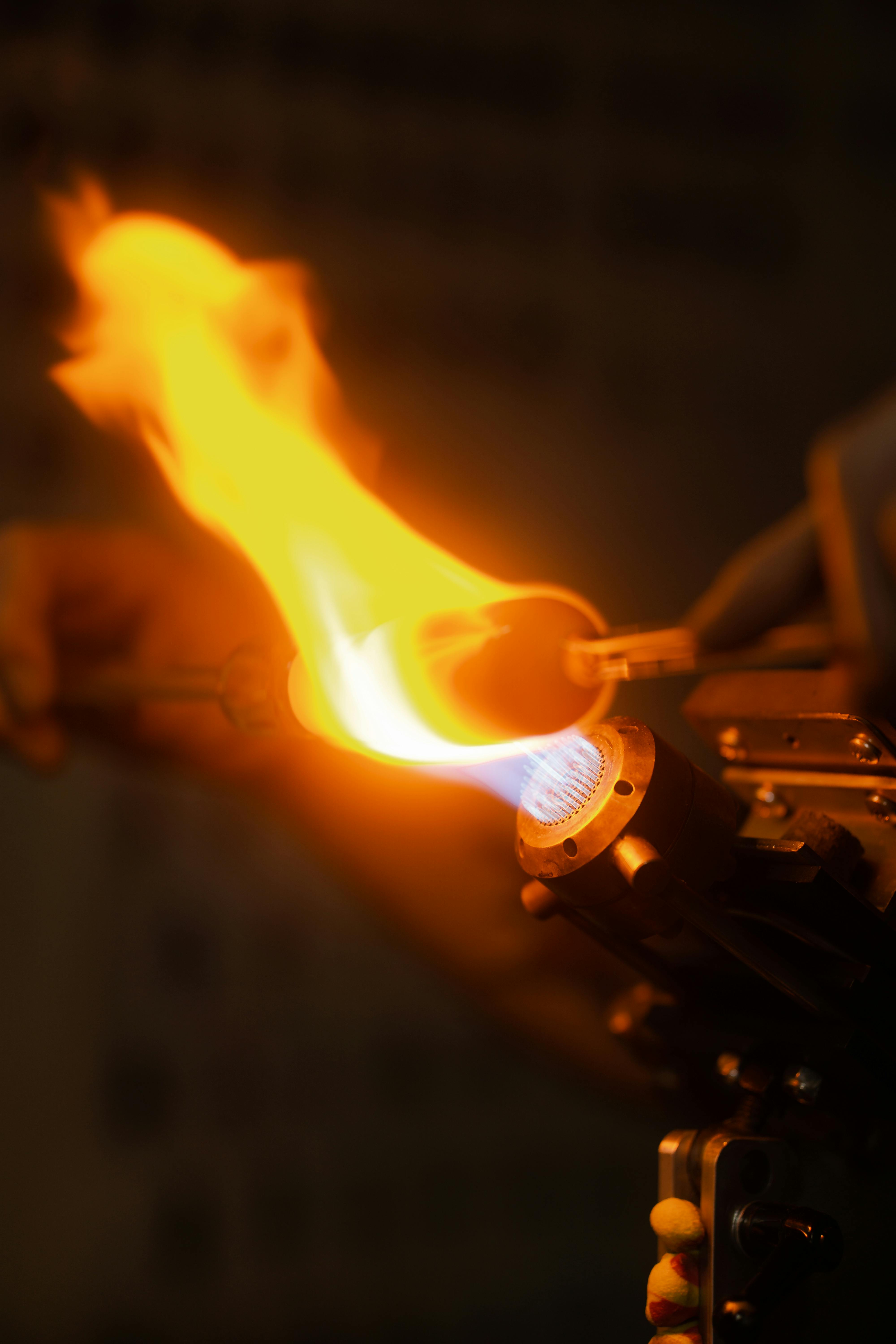 A Lighted Torch on Wooden Stand · Free Stock Photo