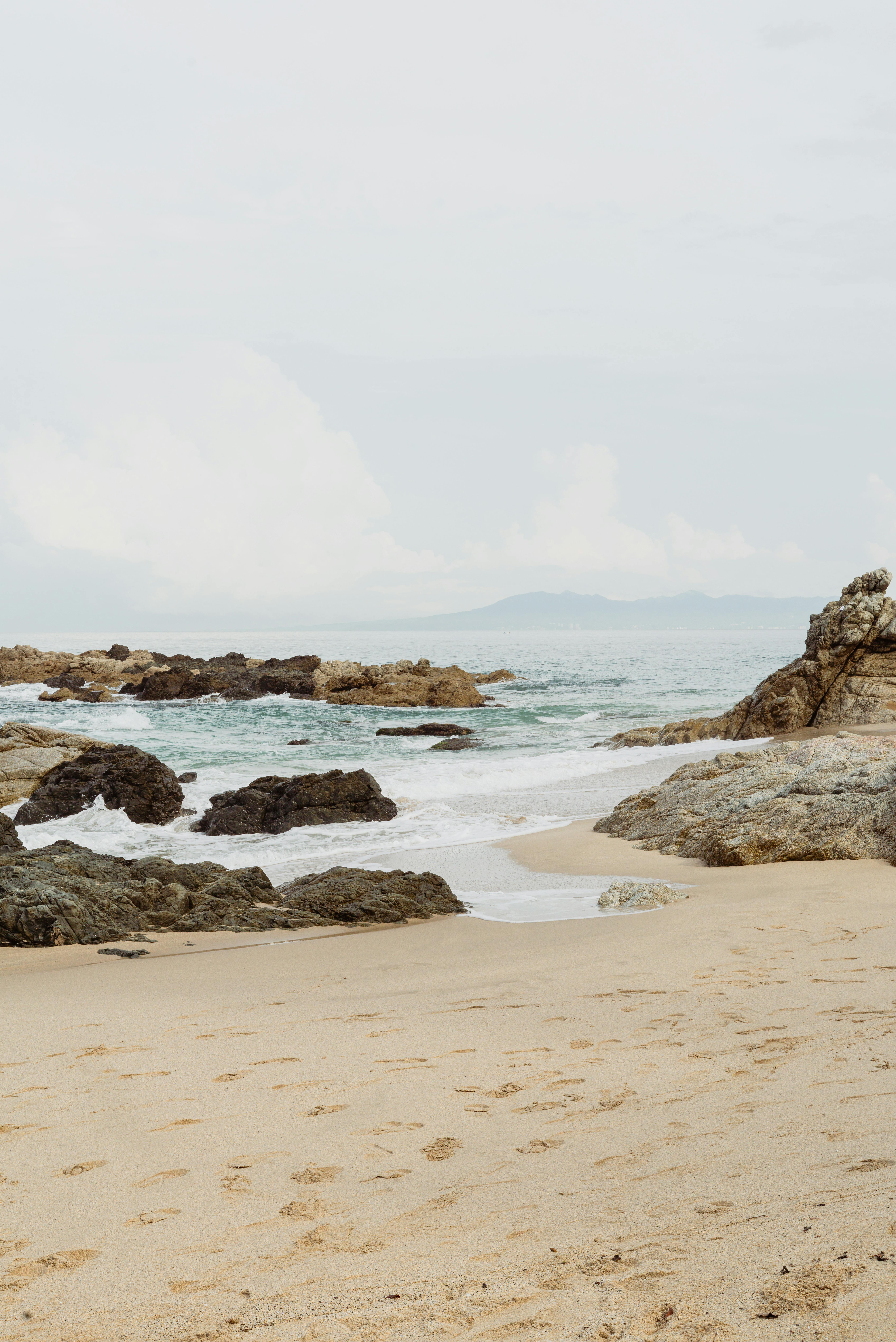 Rocks on Beach and in Sea · Free Stock Photo