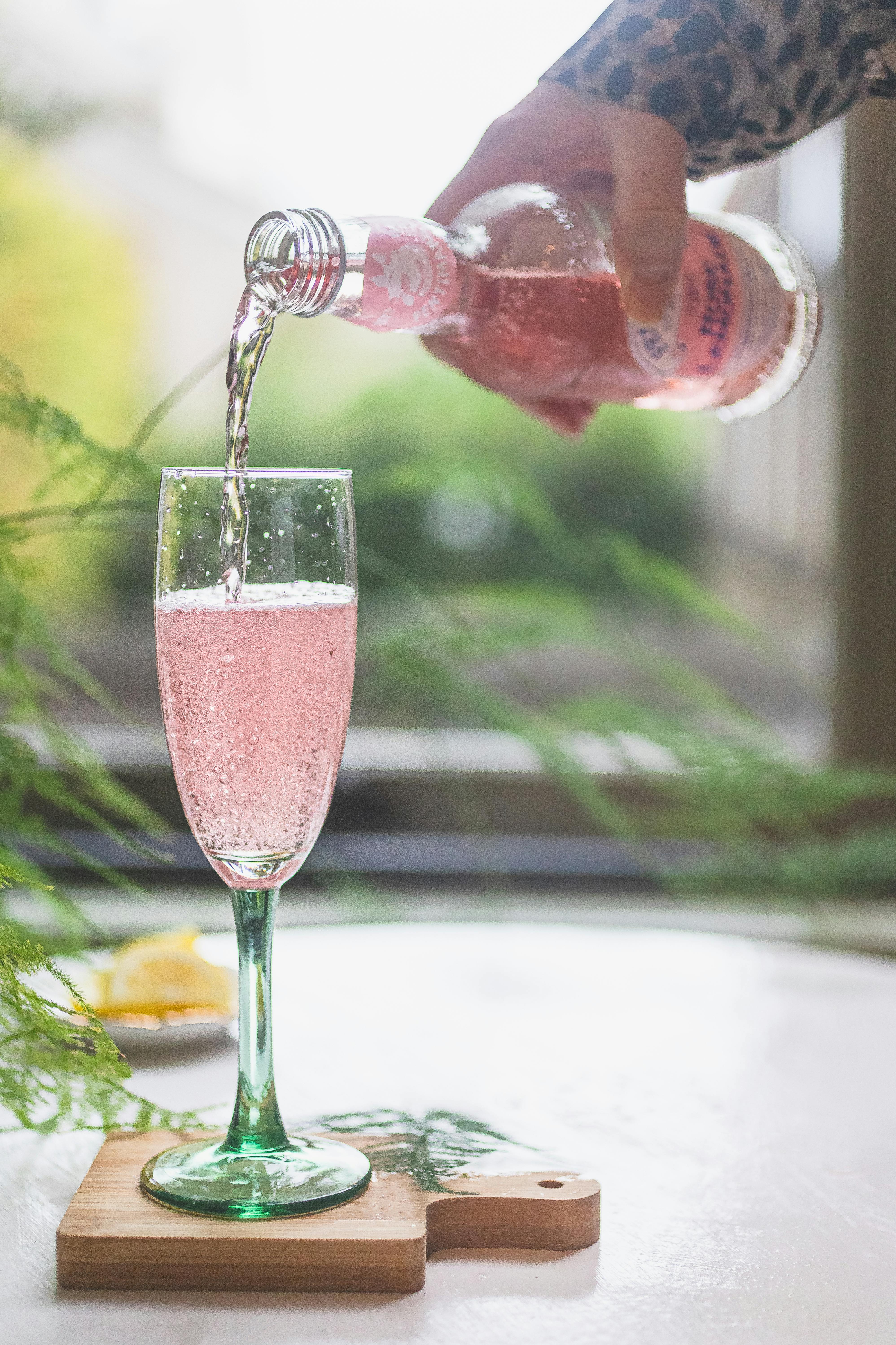 Person Pouring a Drink · Free Stock Photo