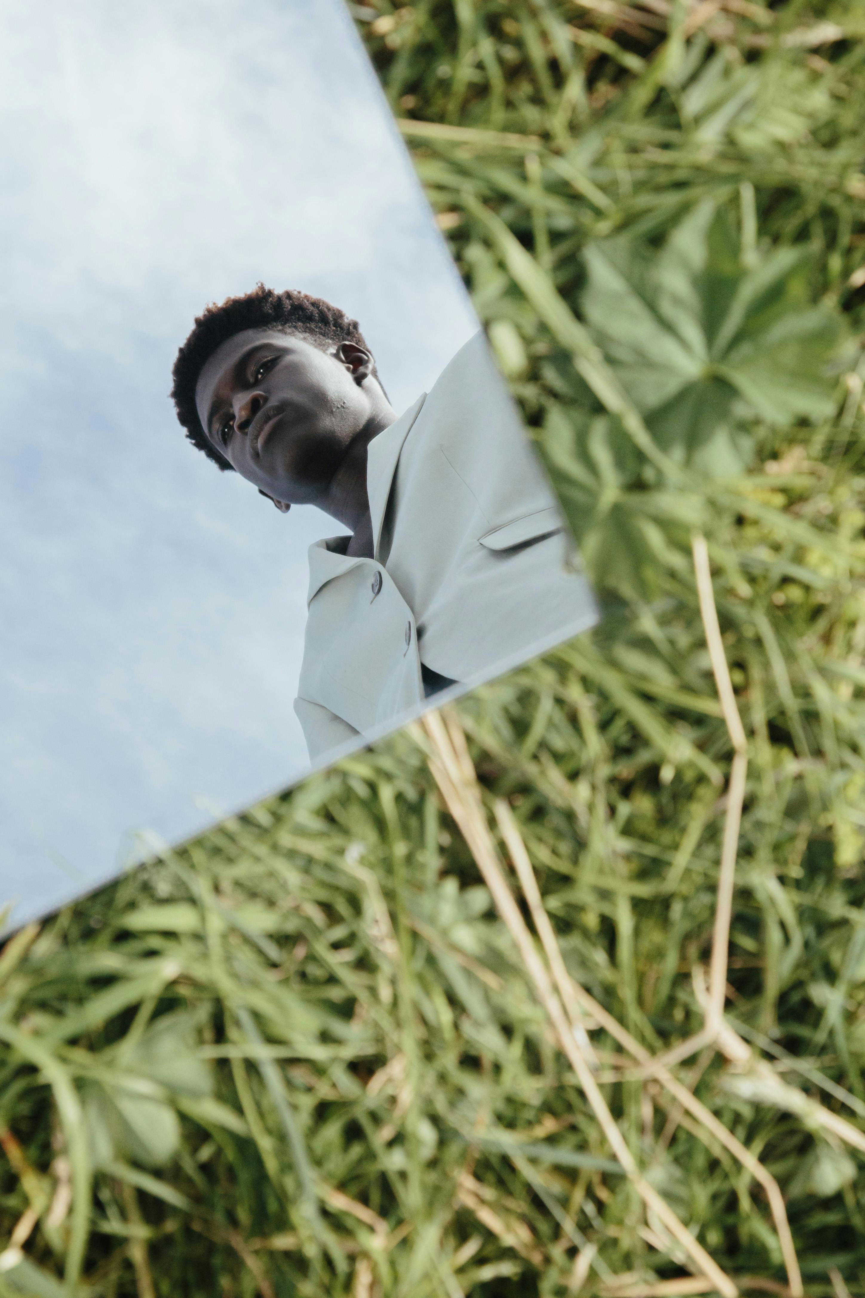 A Reflection of a Man Wearing a Suit · Free Stock Photo