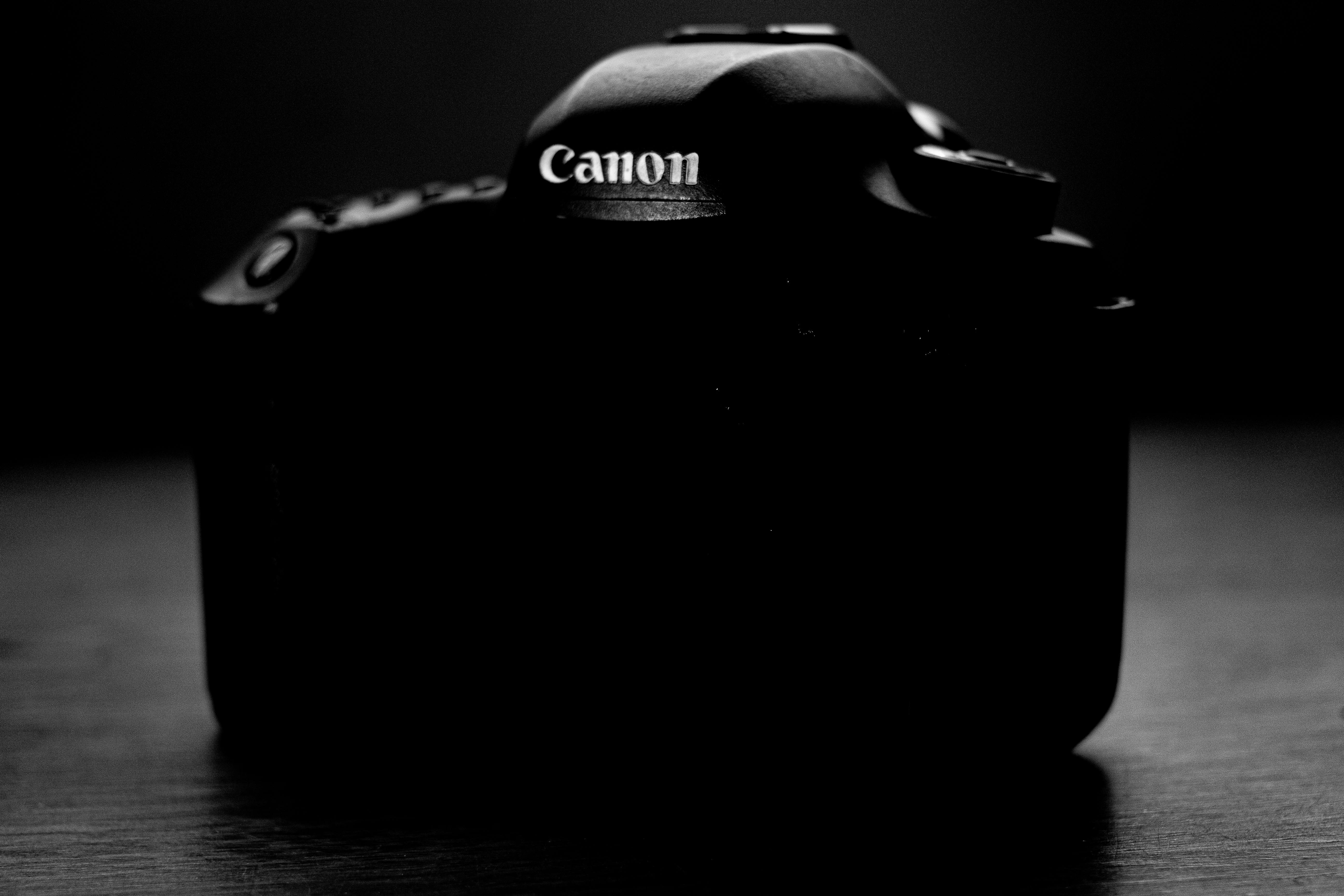 Grayscale Photo of a Canon Camera · Free Stock Photo