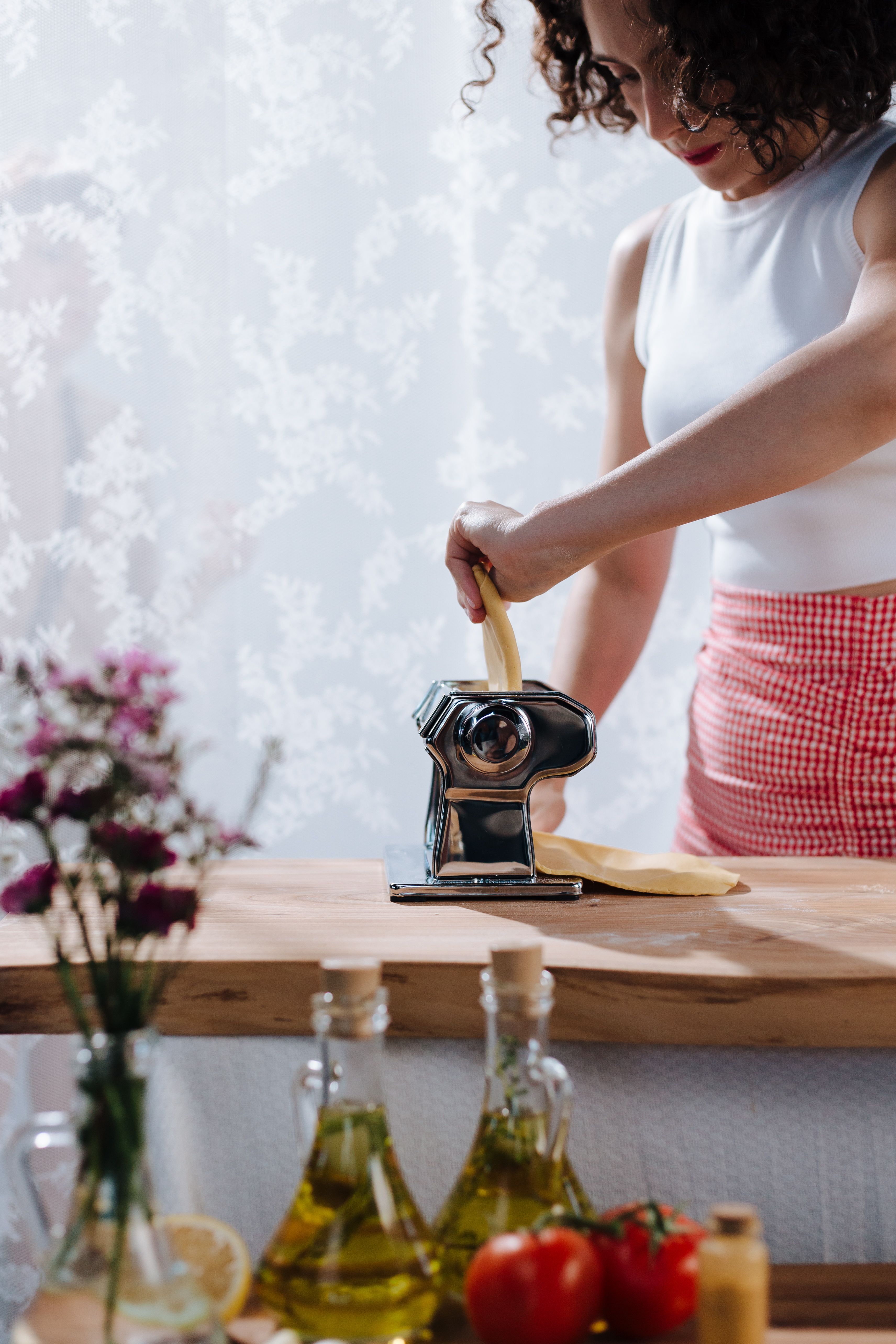 Curly Haired Woman Making Pasta · Free Stock Photo