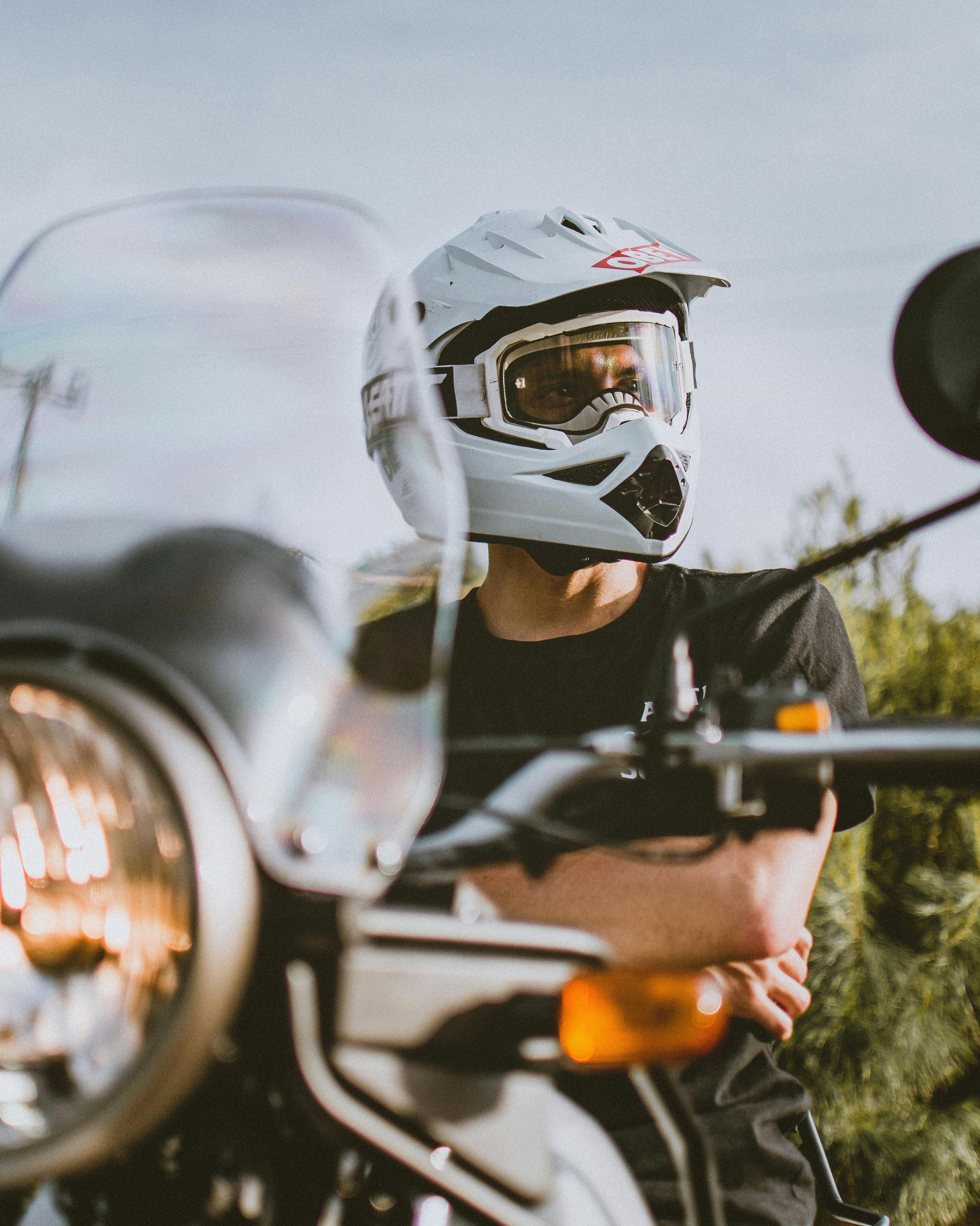 A Person in White Helmet Riding Motorcycle · Free Stock Photo