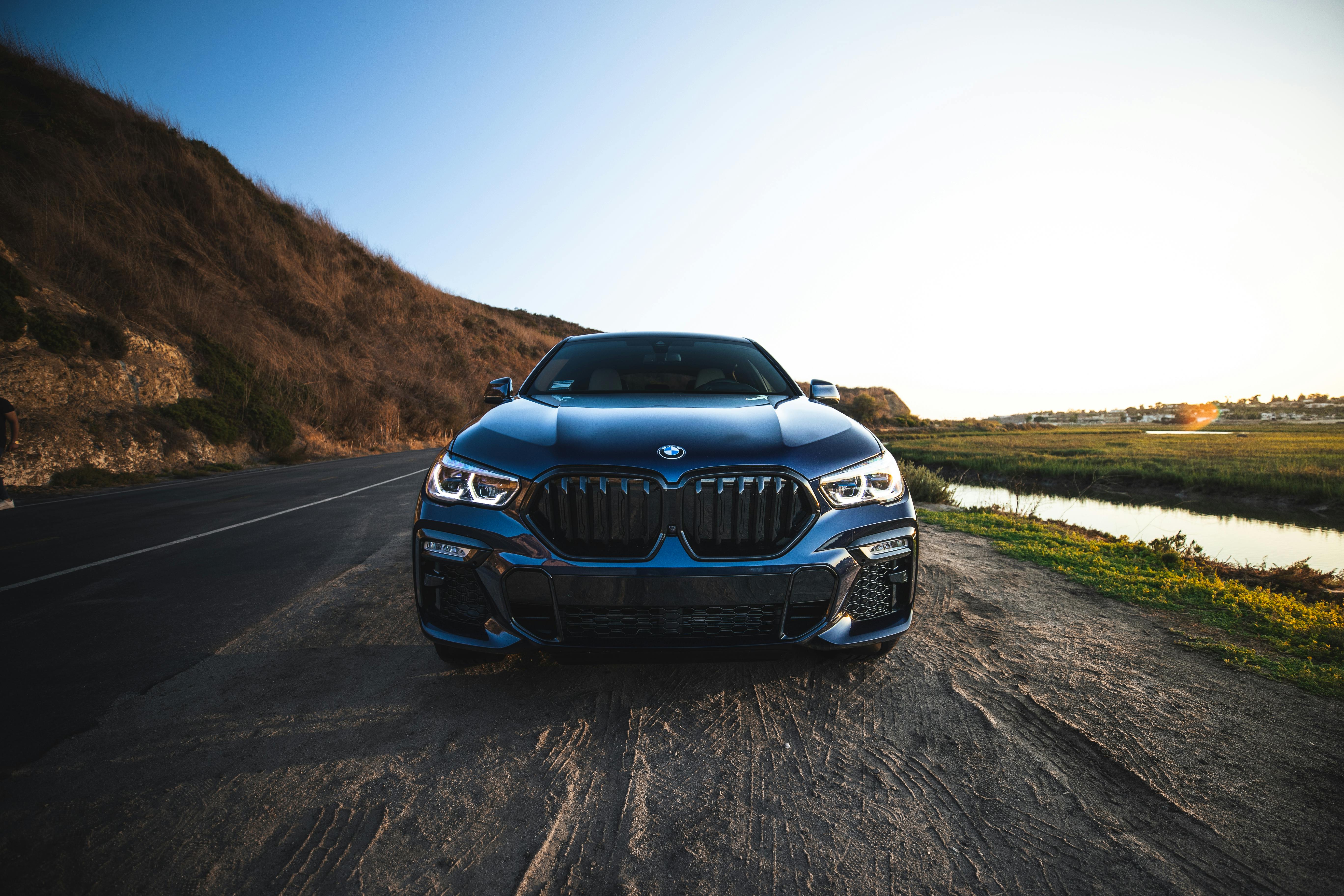 Running BMW Alpina B3 on Road by Desert Hills · Free Stock Photo