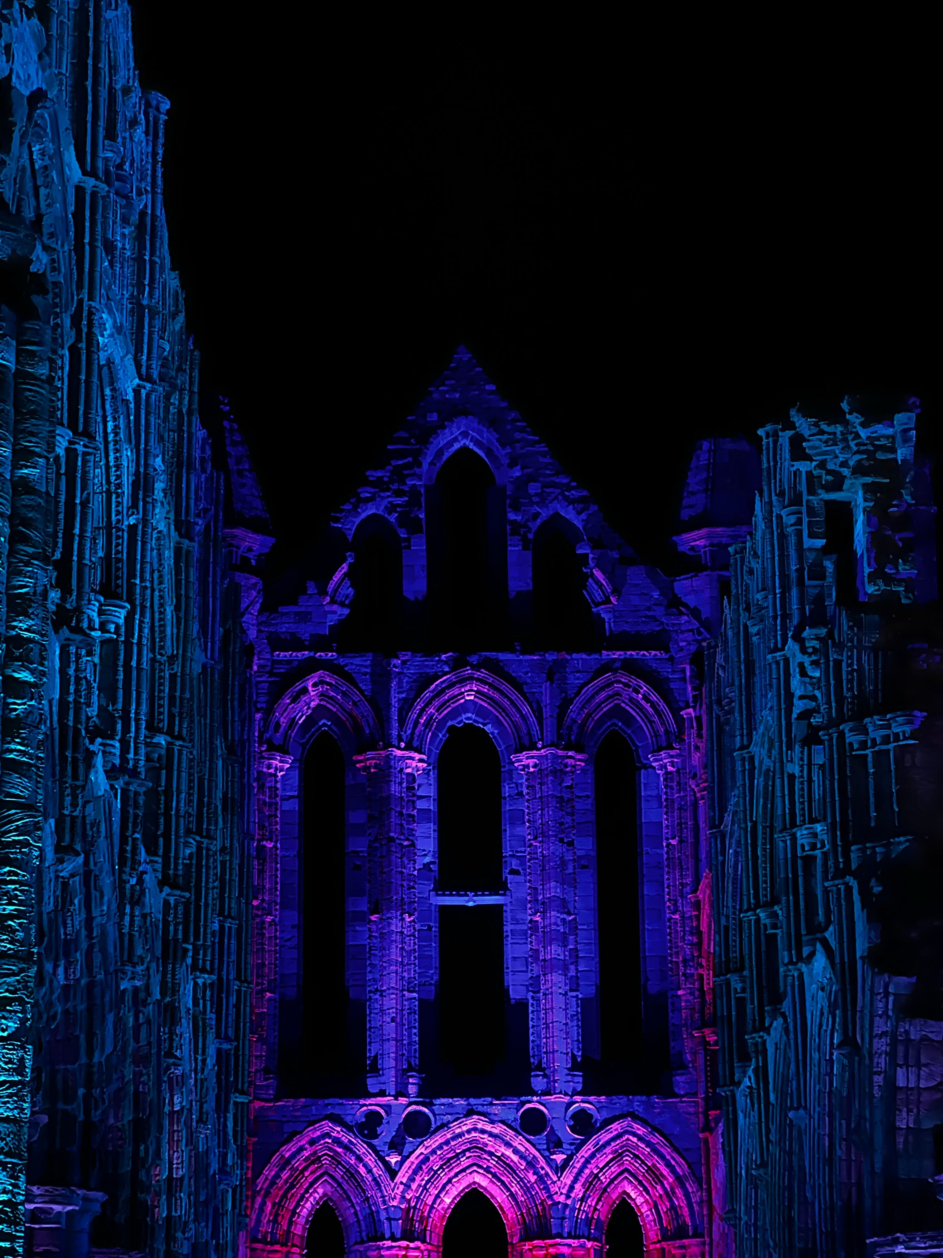 Cathedral Interior Illuminated with Purple Light · Free Stock Photo
