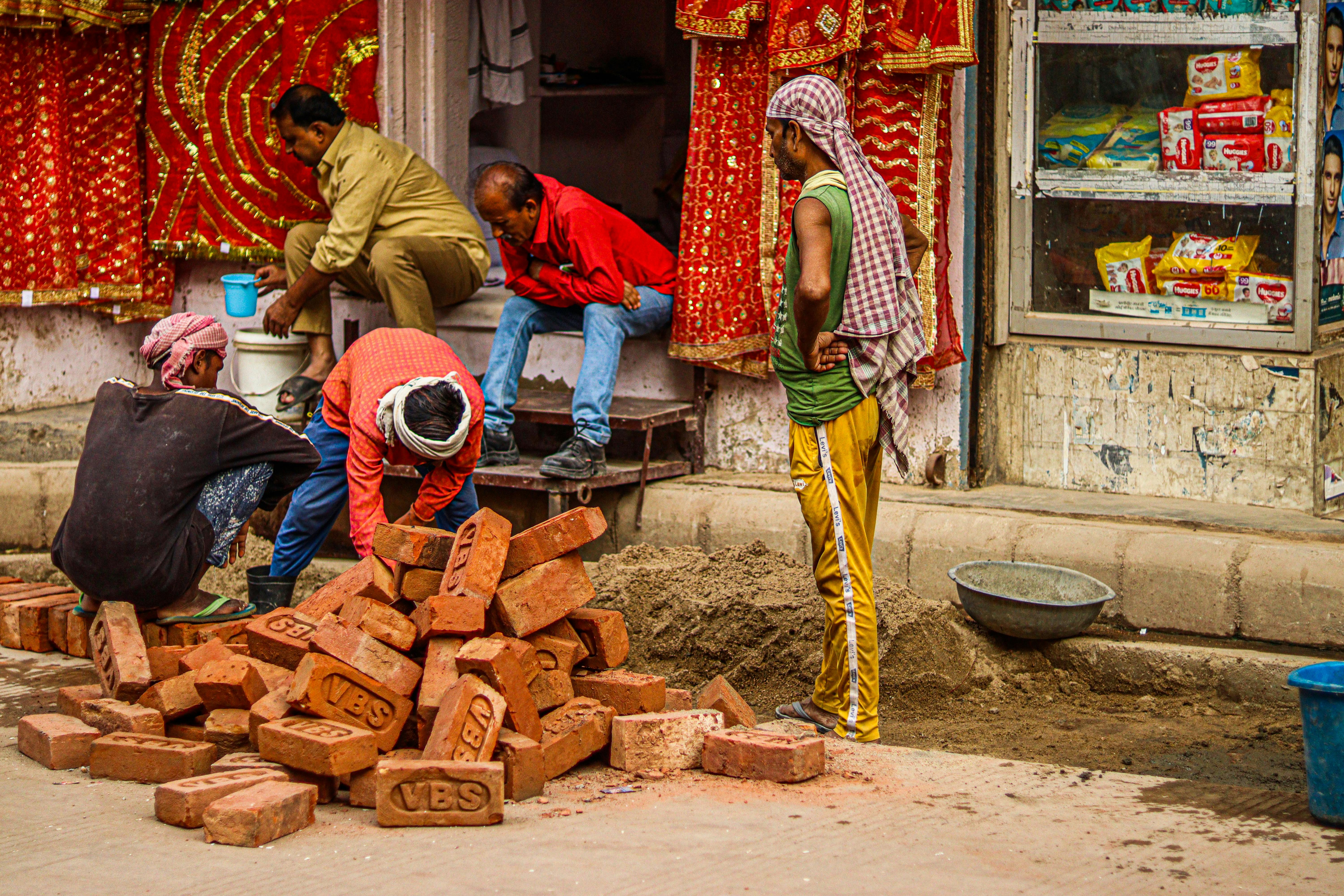 Men Laying Bricks · Free Stock Photo