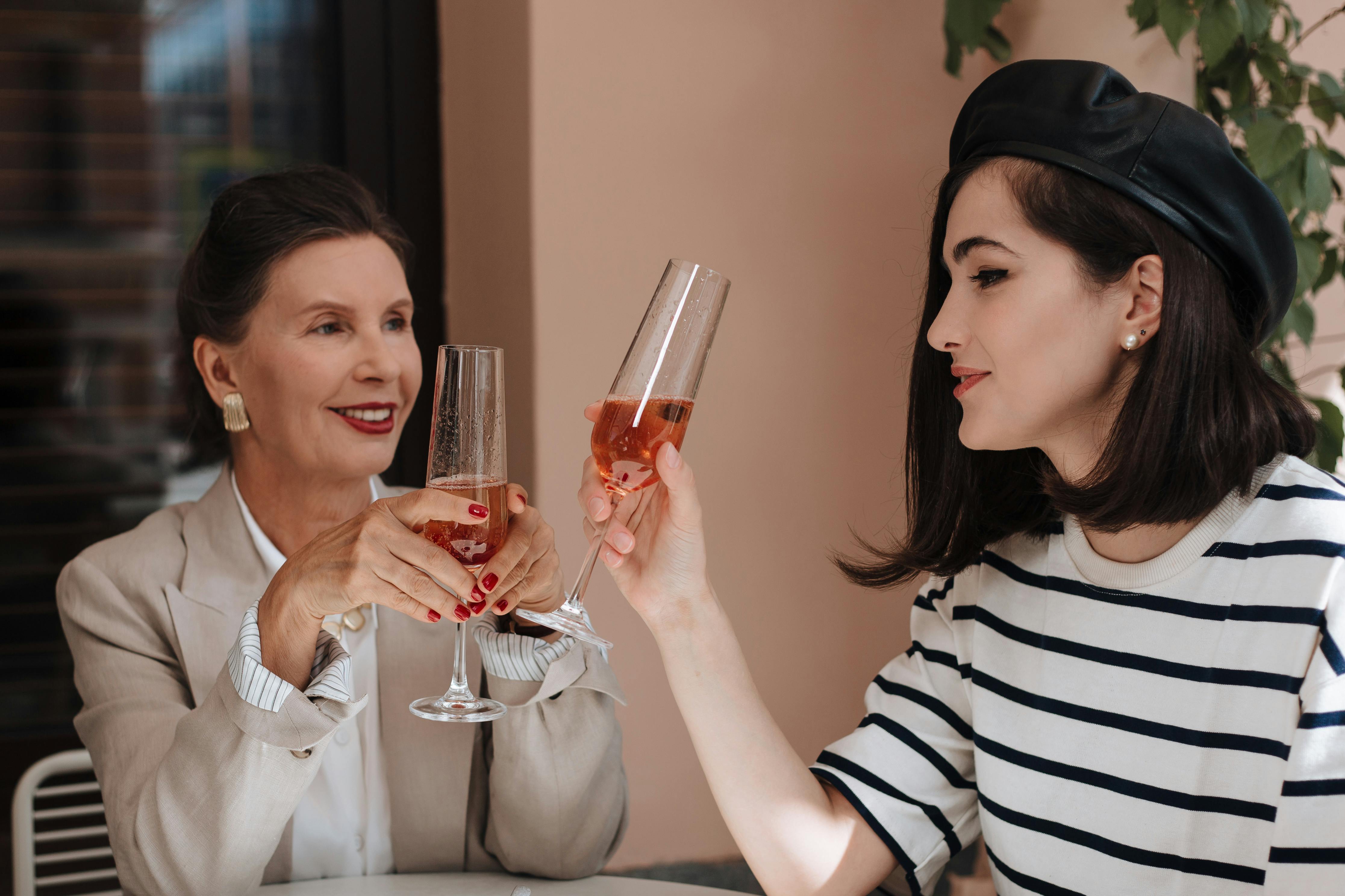 Women Having Conversation while Holding a Glass of Champagne · Free ...