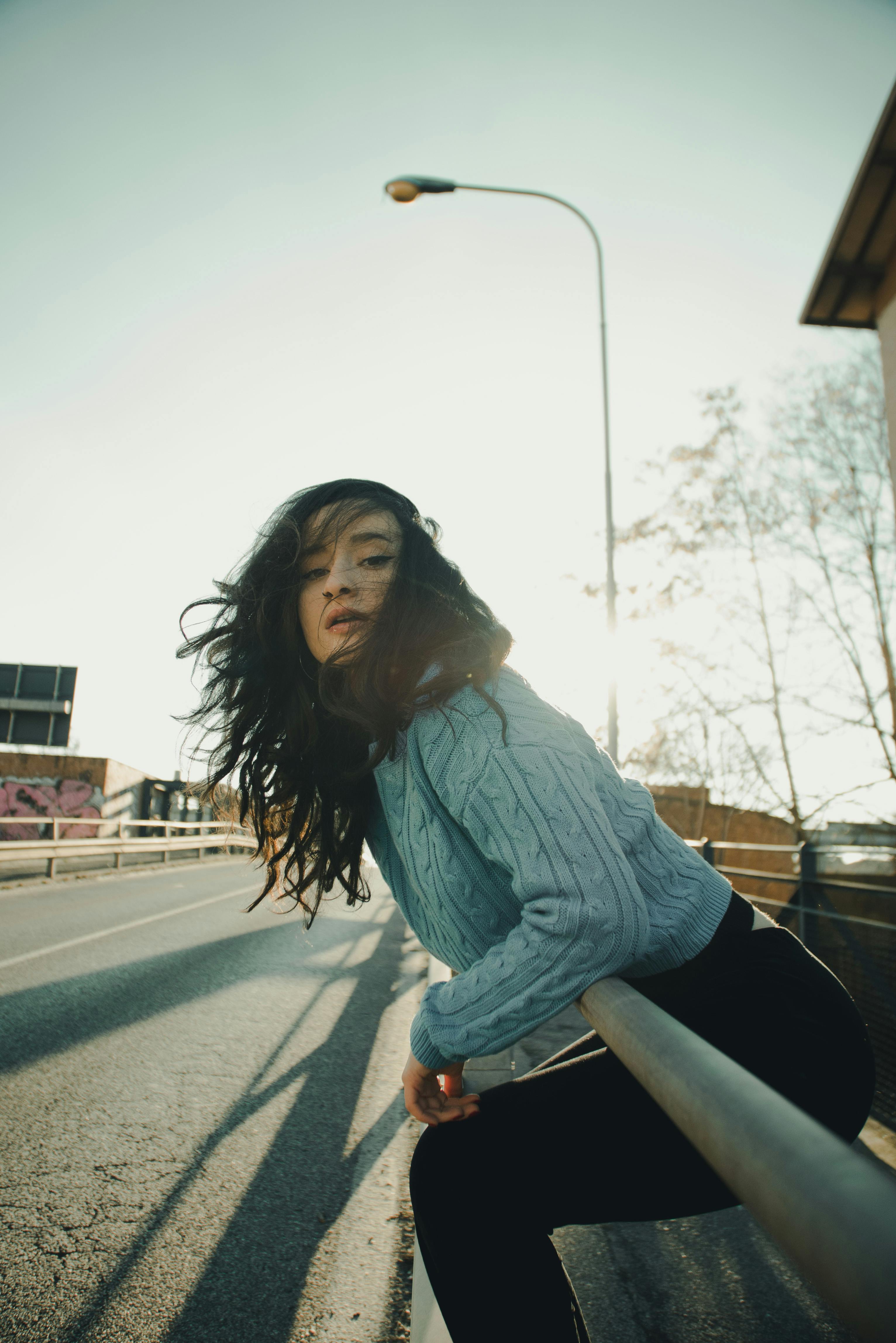 Brunette Woman Leaning on Railing · Free Stock Photo