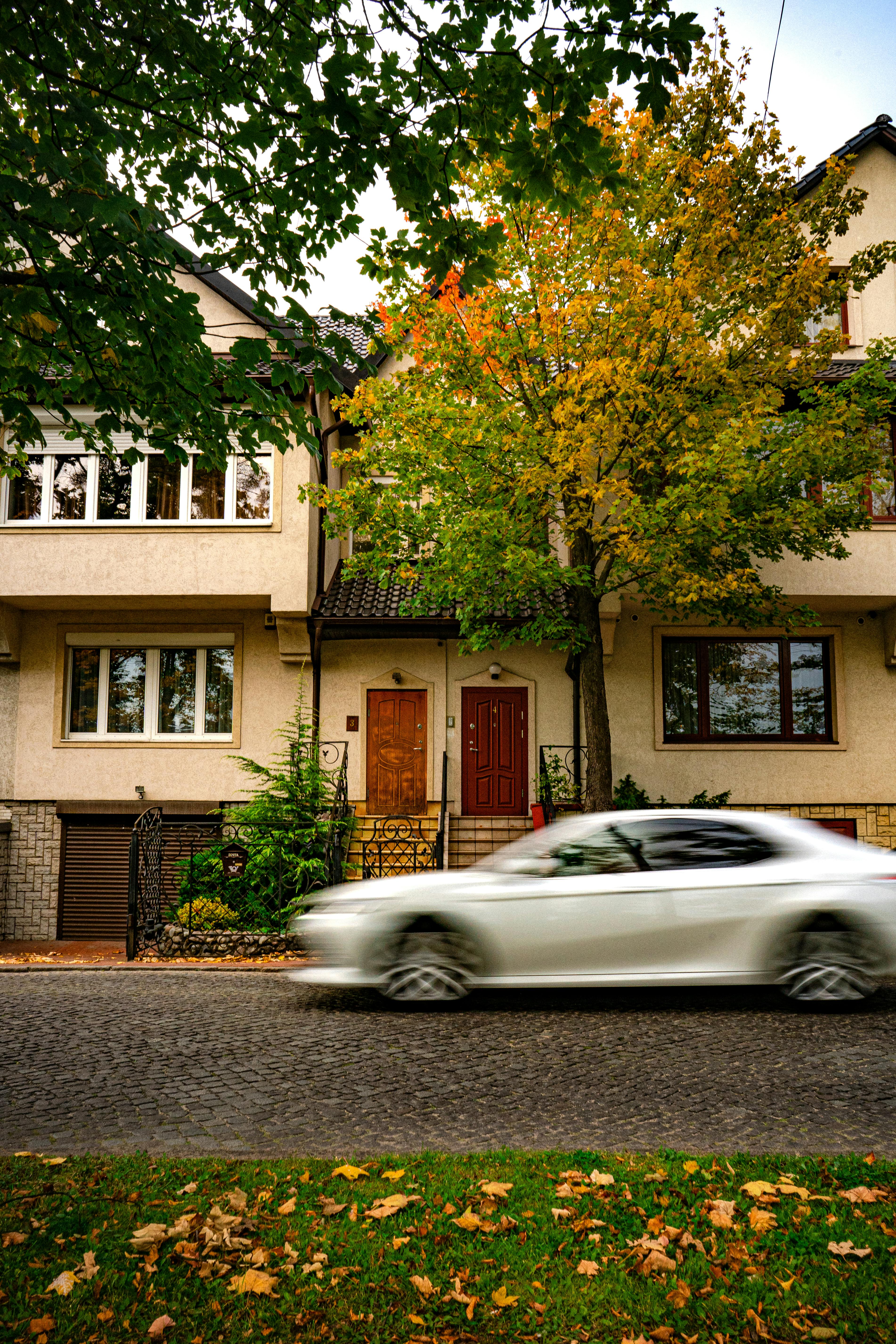 Car Driving Through the Neighbourhood · Free Stock Photo