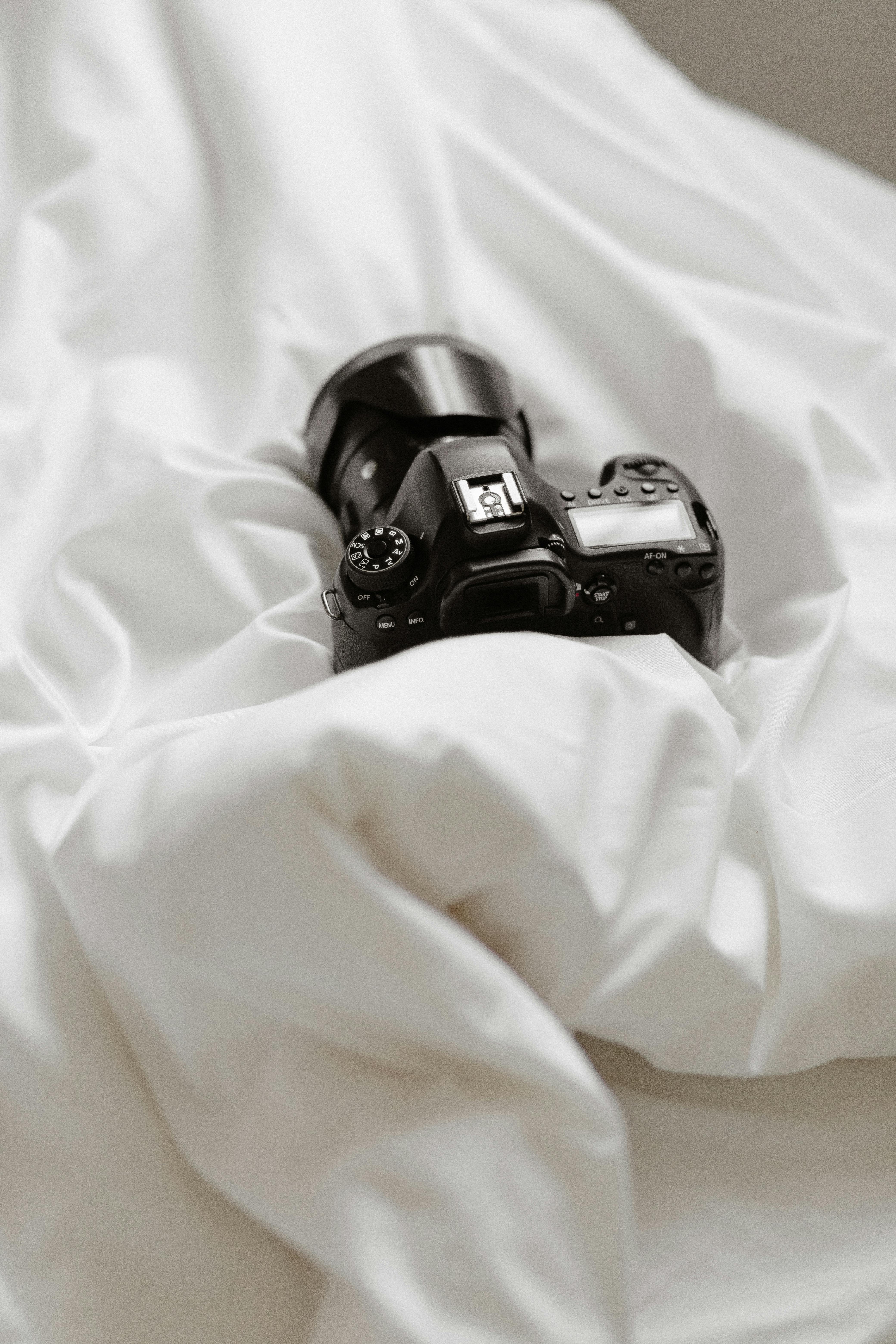 A Camera on a Bed · Free Stock Photo