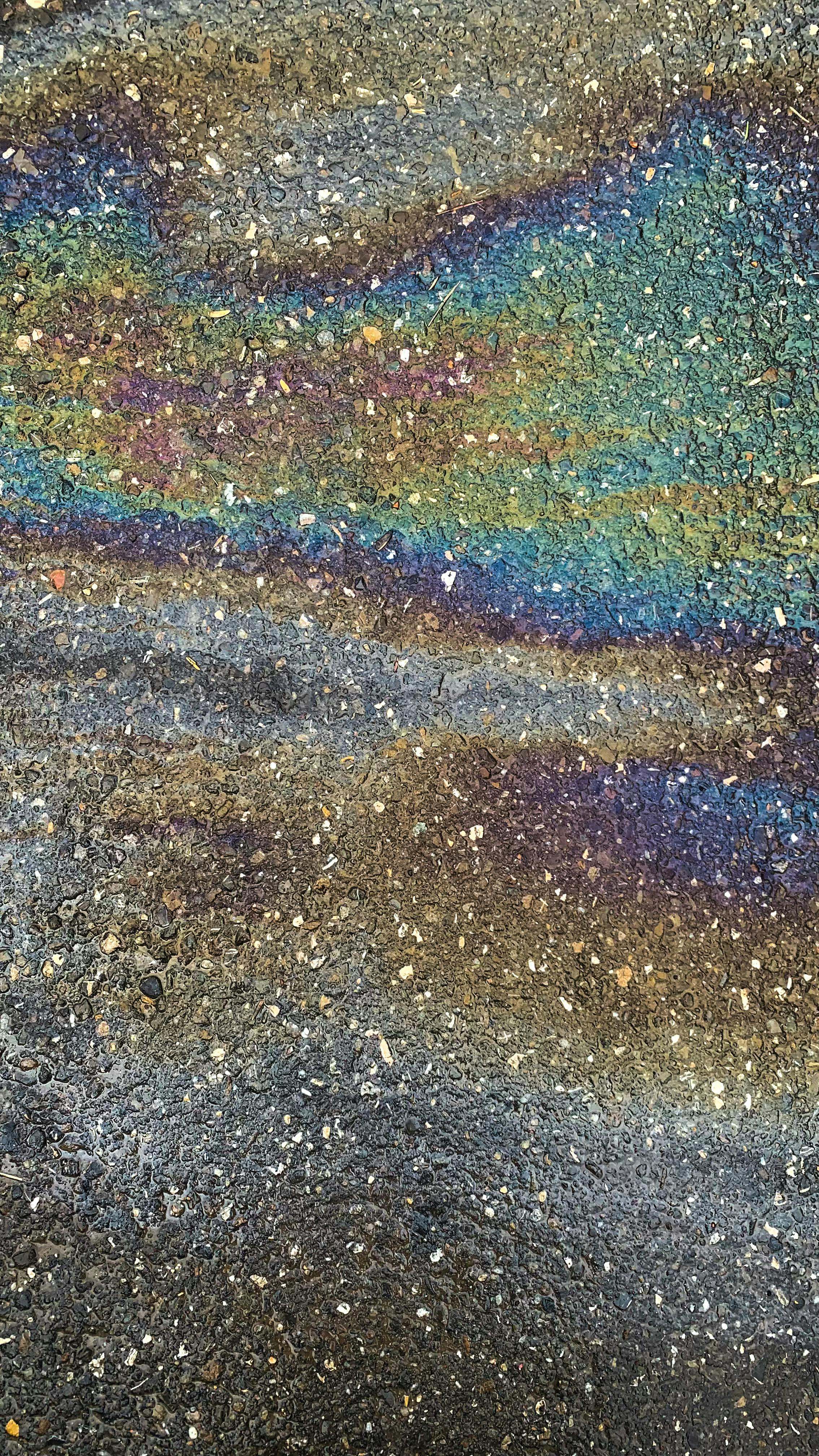 Colorful Oil Stains on Pavement · Free Stock Photo