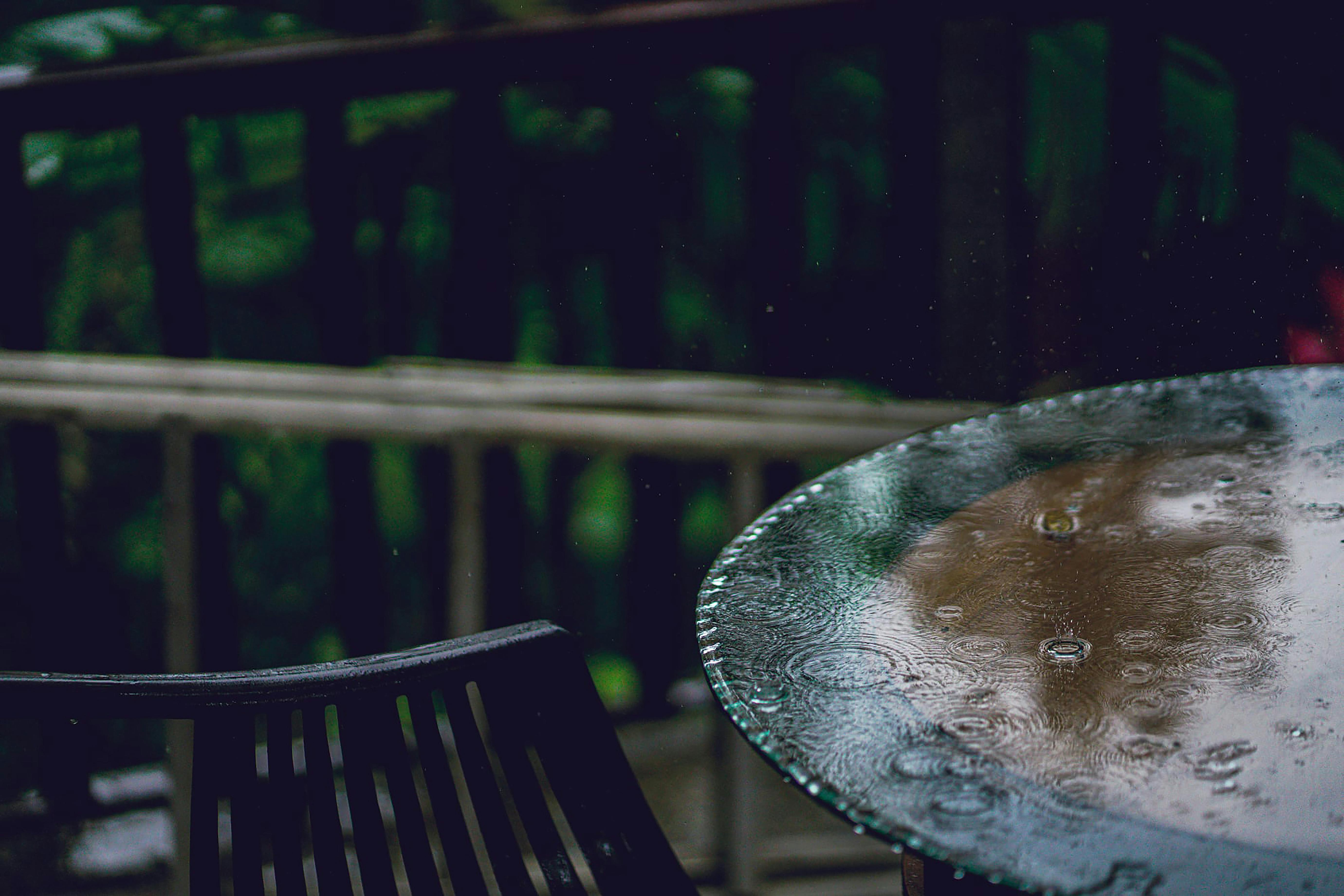 Selective Focus Photo of a Wet Table During a Rainy Day · Free Stock Photo
