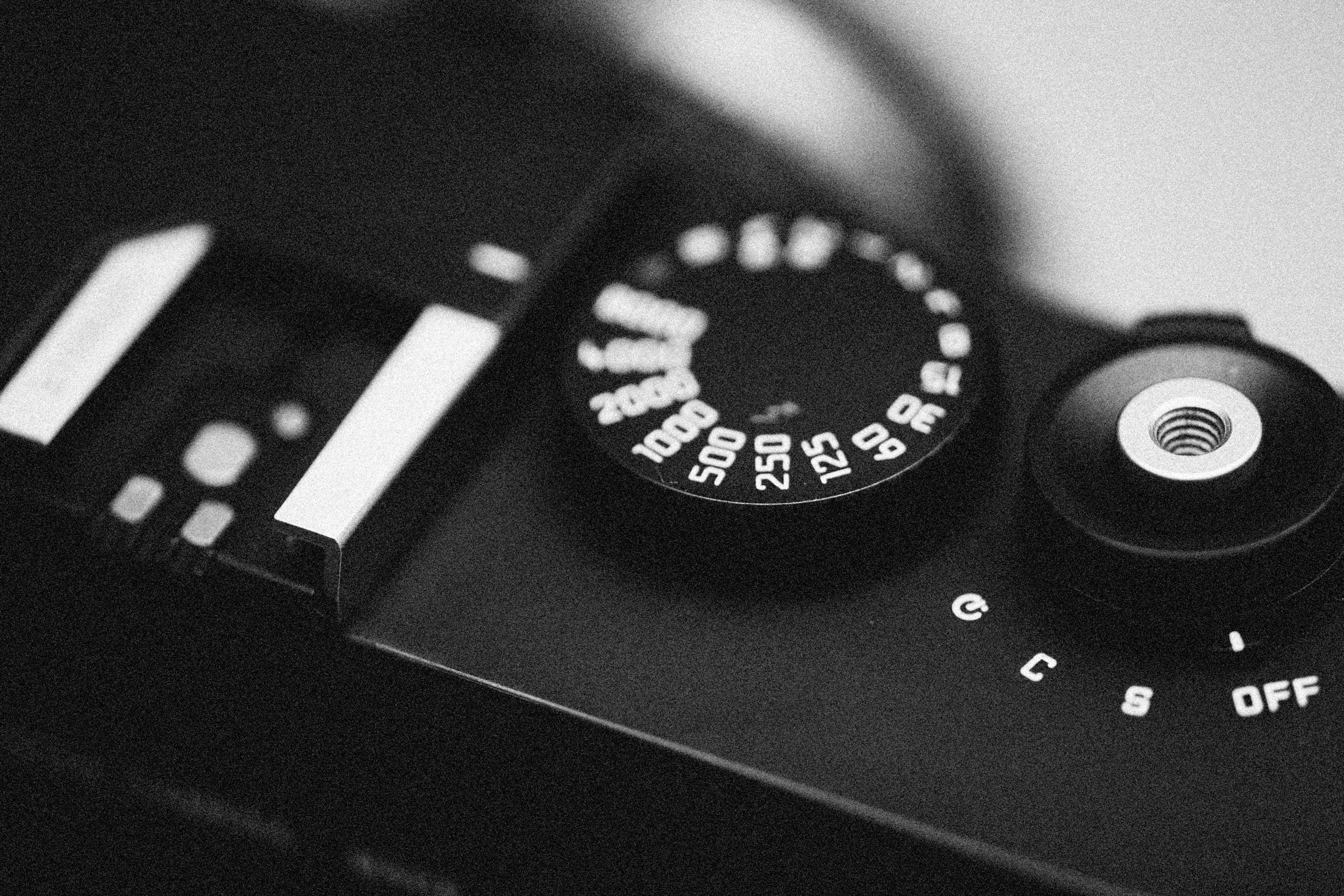 Blakc Camera on White Textile · Free Stock Photo